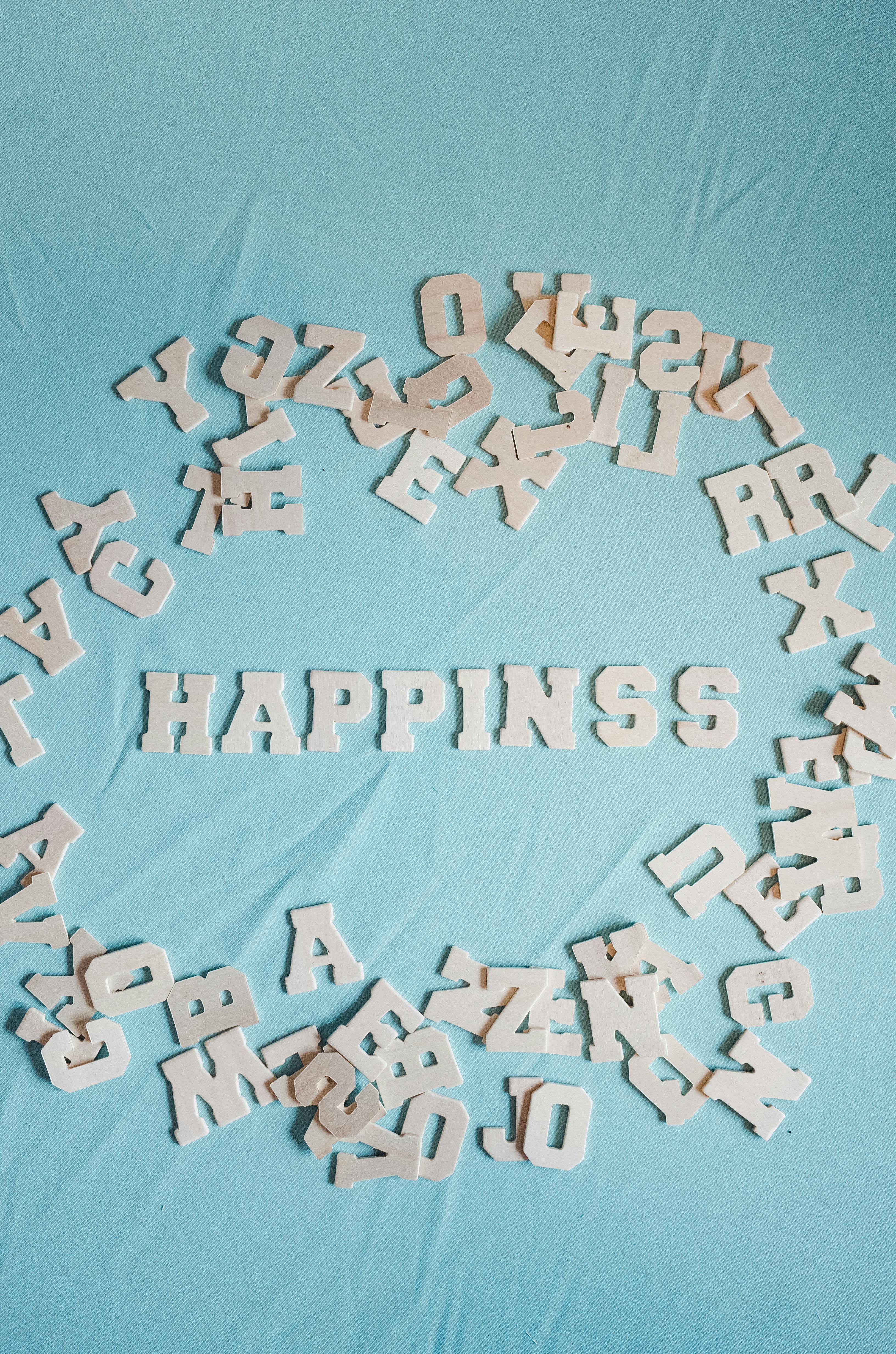 Happiness Text among Letters · Free Stock Photo