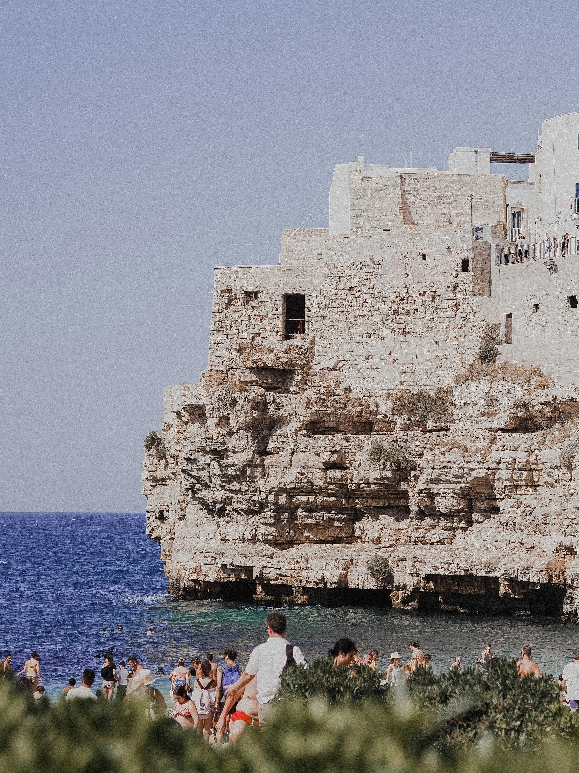 Brick Building on Rock Formations on the Edge of a Cliff · Free Stock Photo