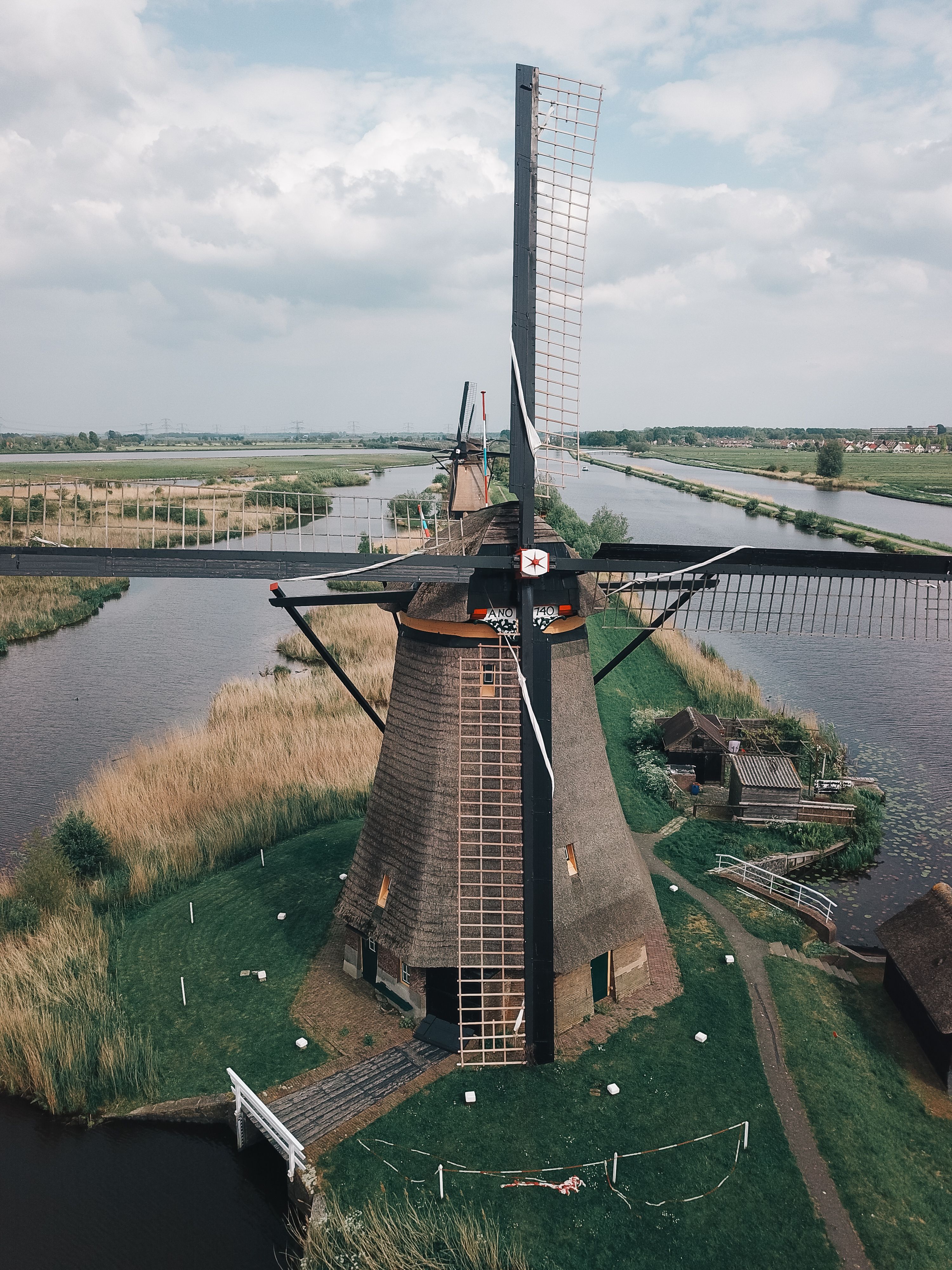 White Windmill with Wooden Construction · Free Stock Photo