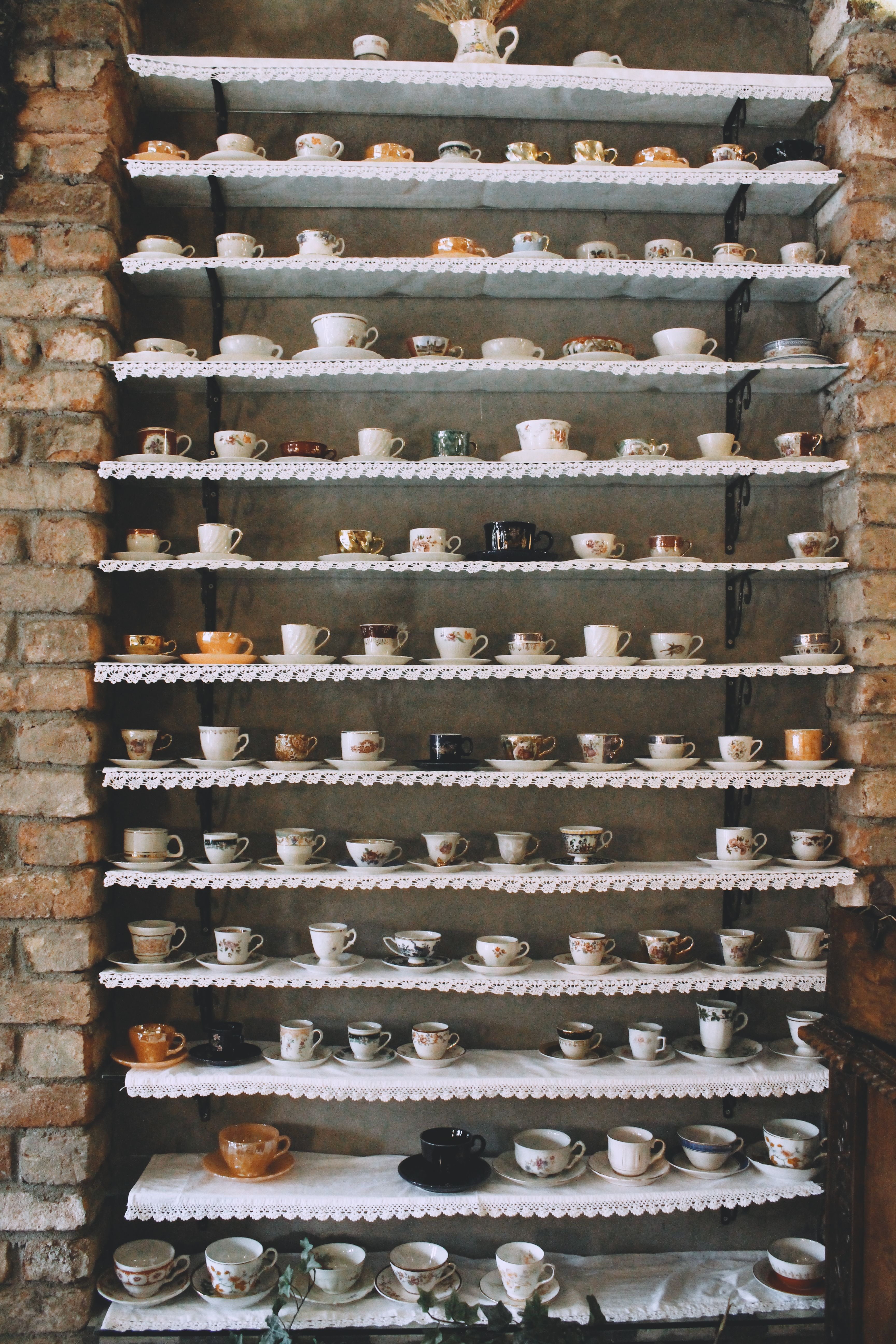 A Collection of Cups in the Shelves · Free Stock Photo