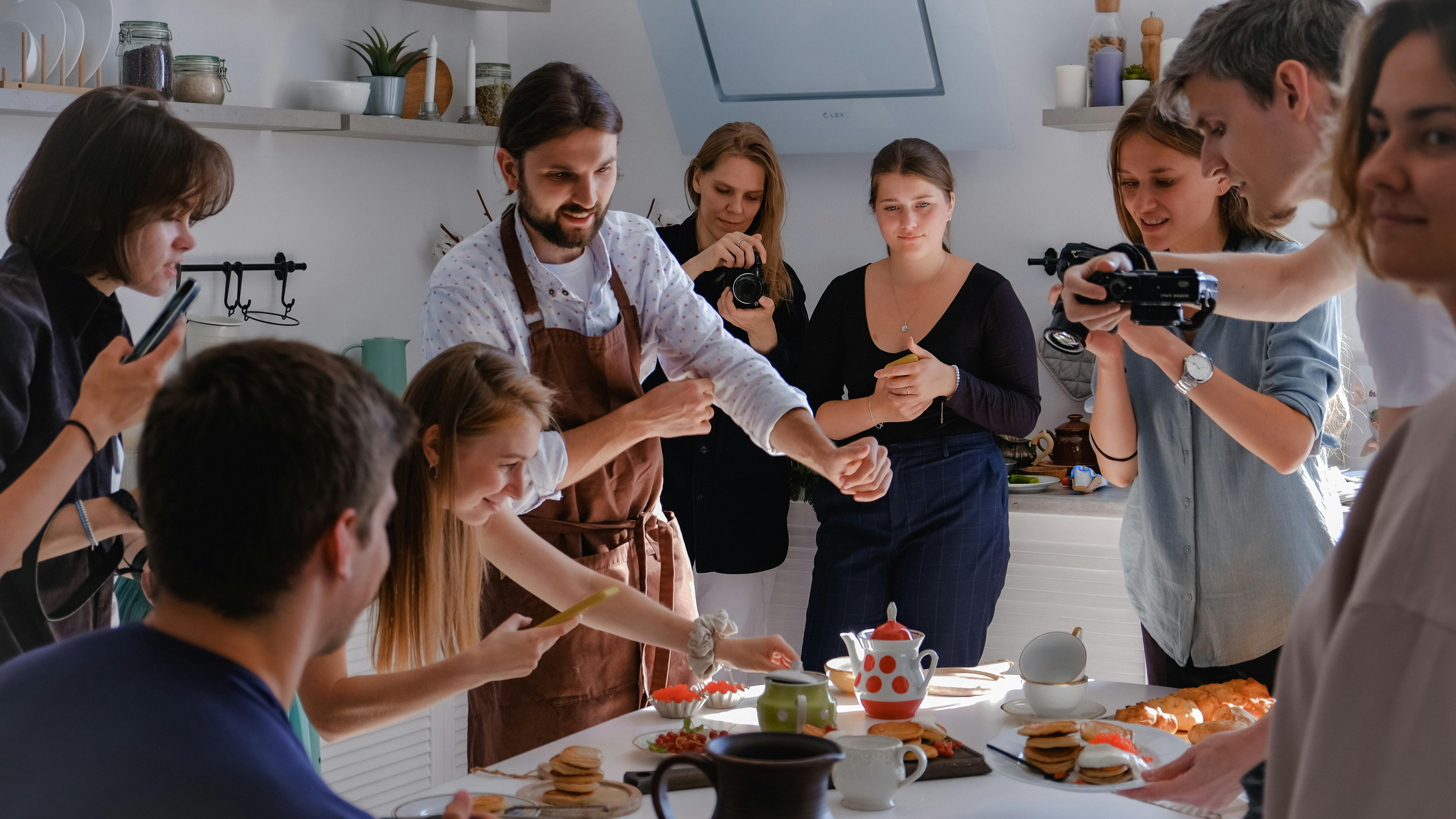 People Taking Photo of Food on the Table · Free Stock Photo