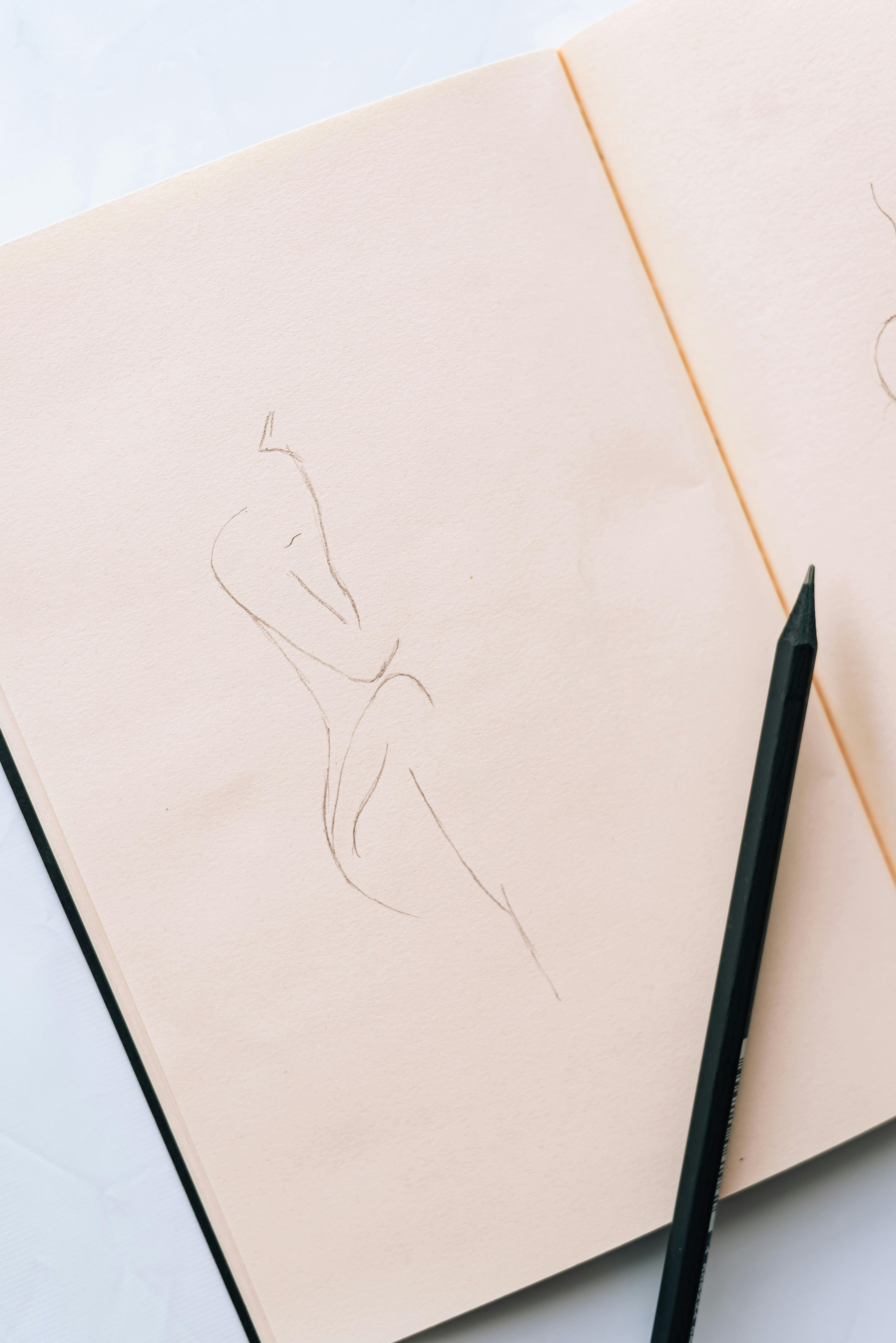 A Drawing on a Notebook · Free Stock Photo