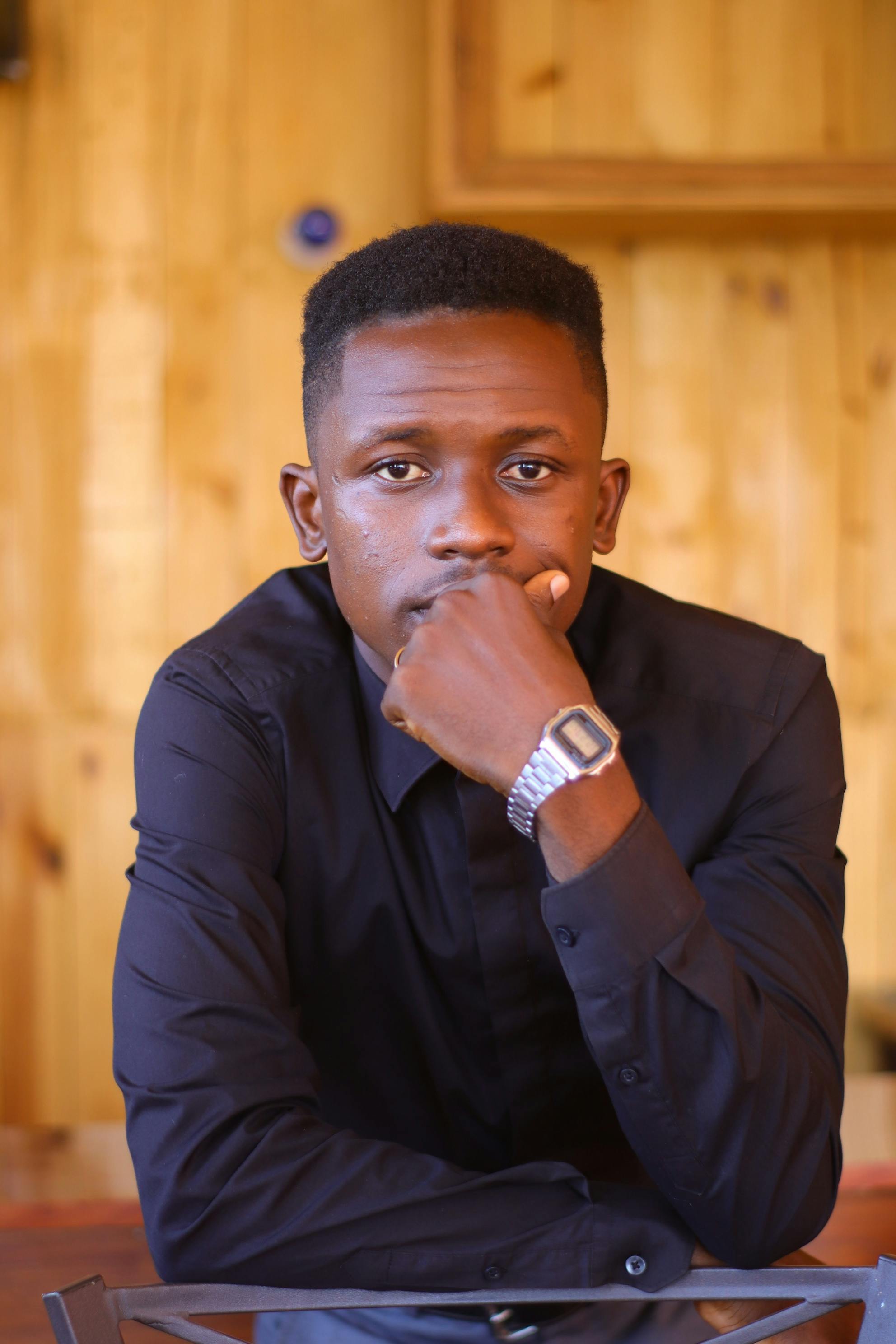 A Pastor in Black Long Sleeves Breaking Bread · Free Stock Photo