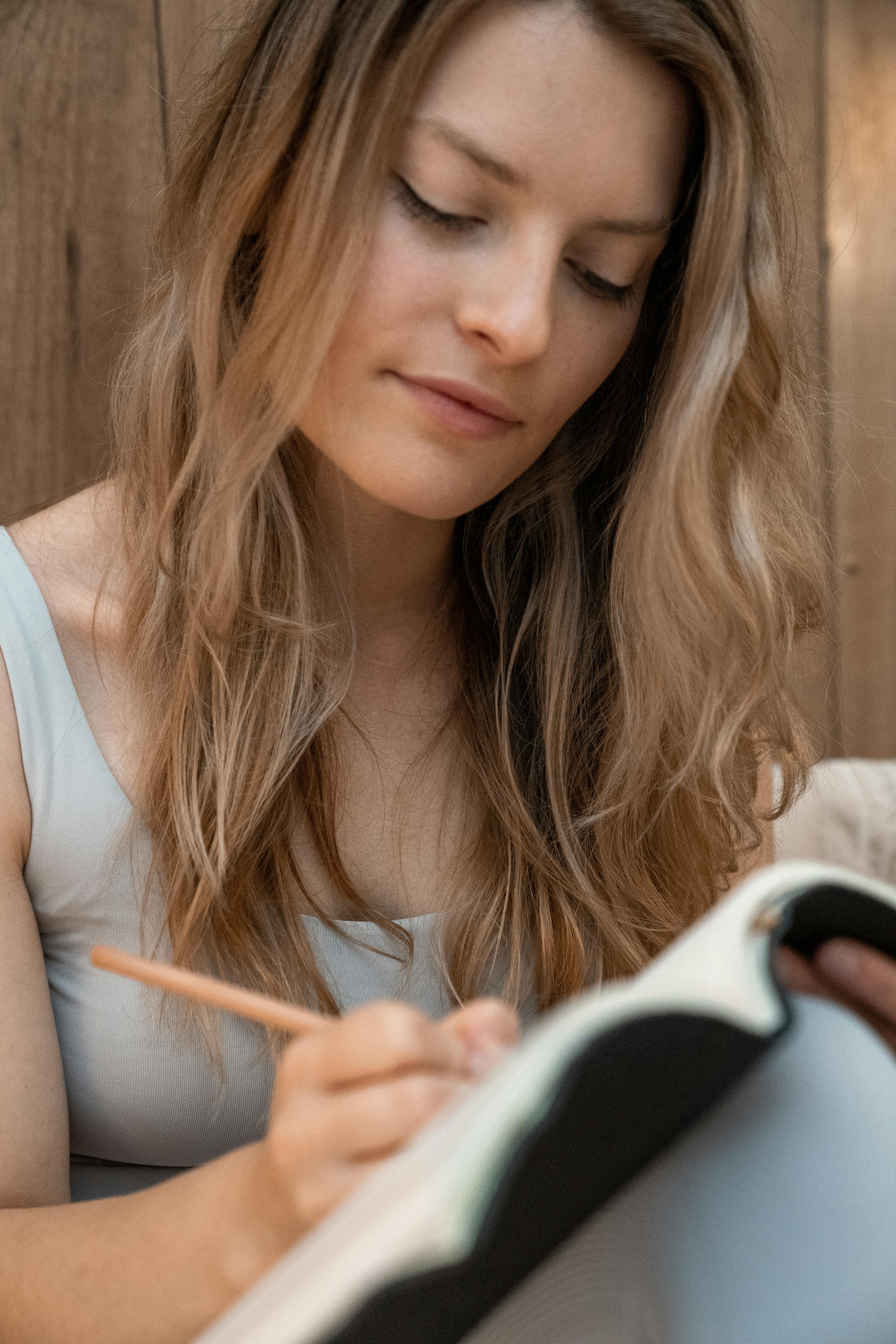 Calm crop woman with mock up notebook · Free Stock Photo