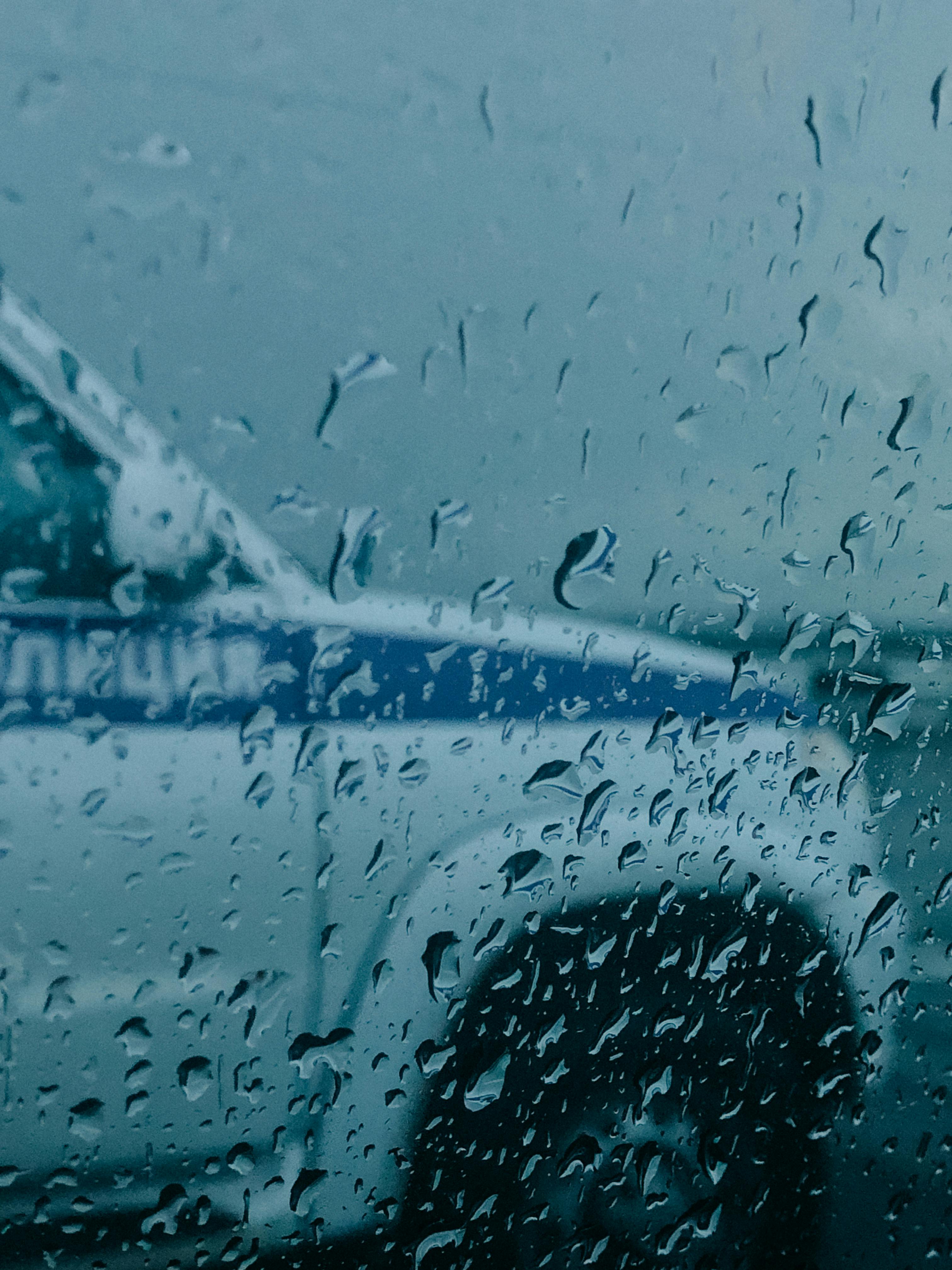 A Wet Glass Window with Water Droplets · Free Stock Photo