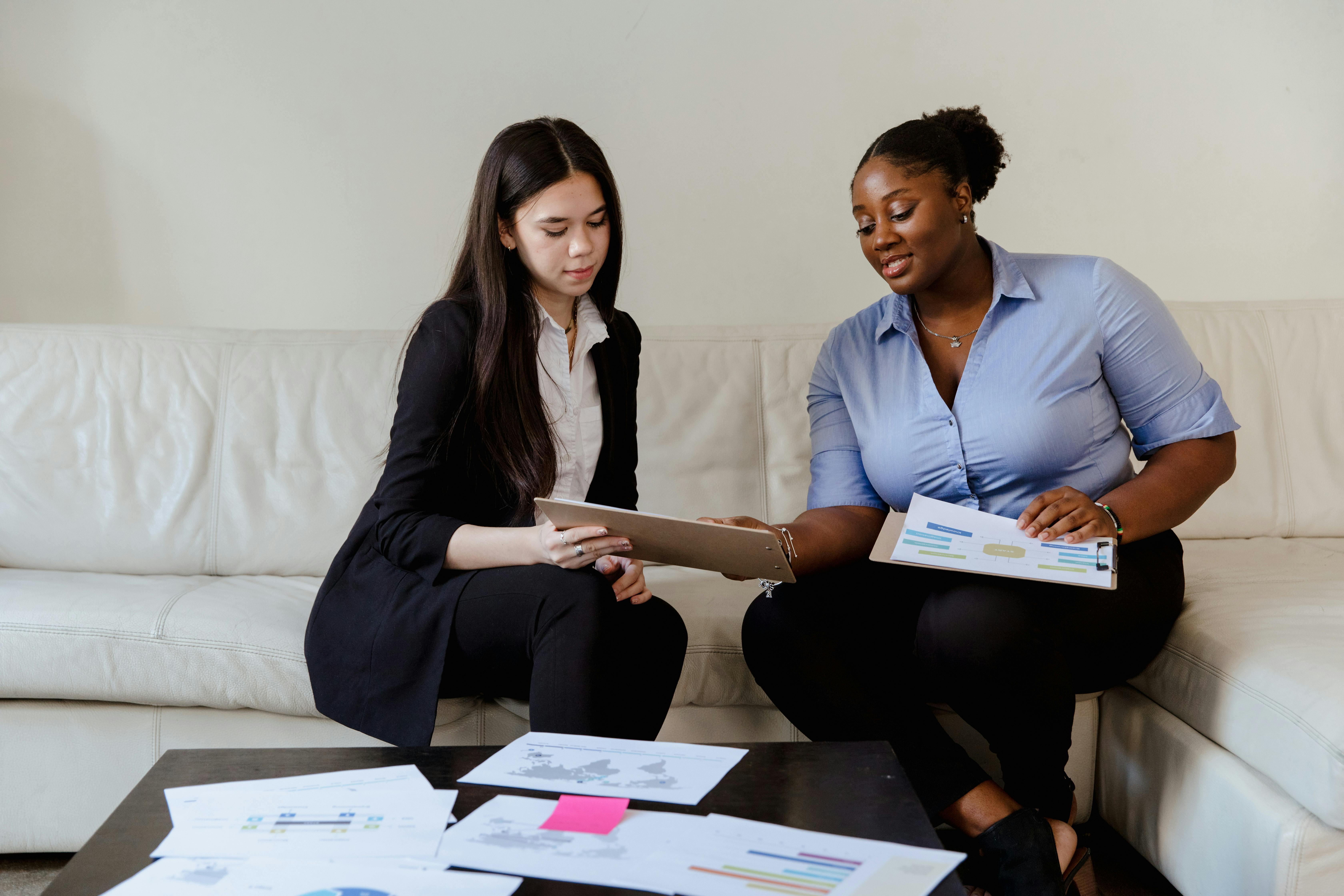 Women Having Conversation while Looking at Each Other · Free Stock Photo