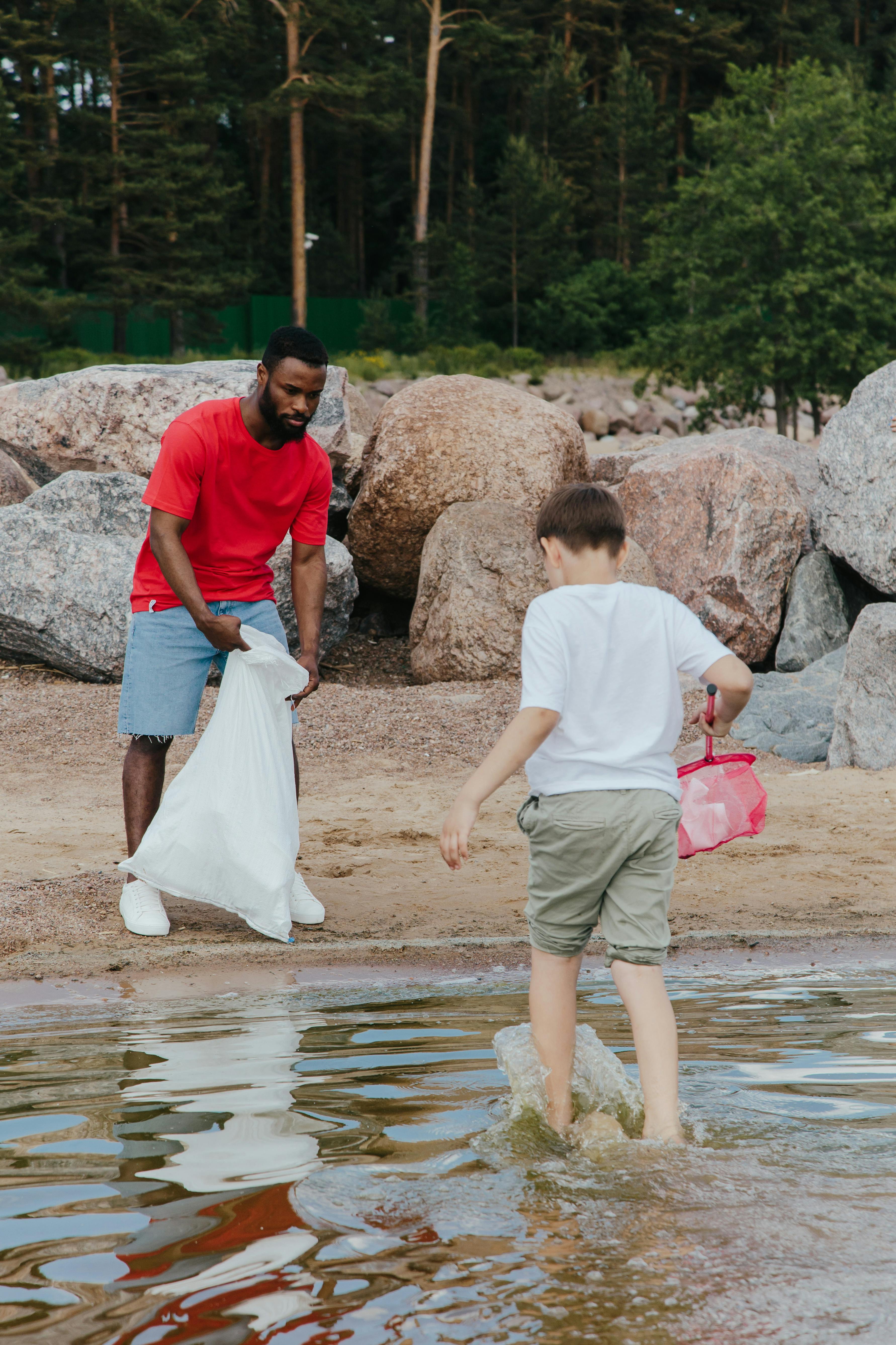 Two Men Cleaning at the Beach · Free Stock Photo