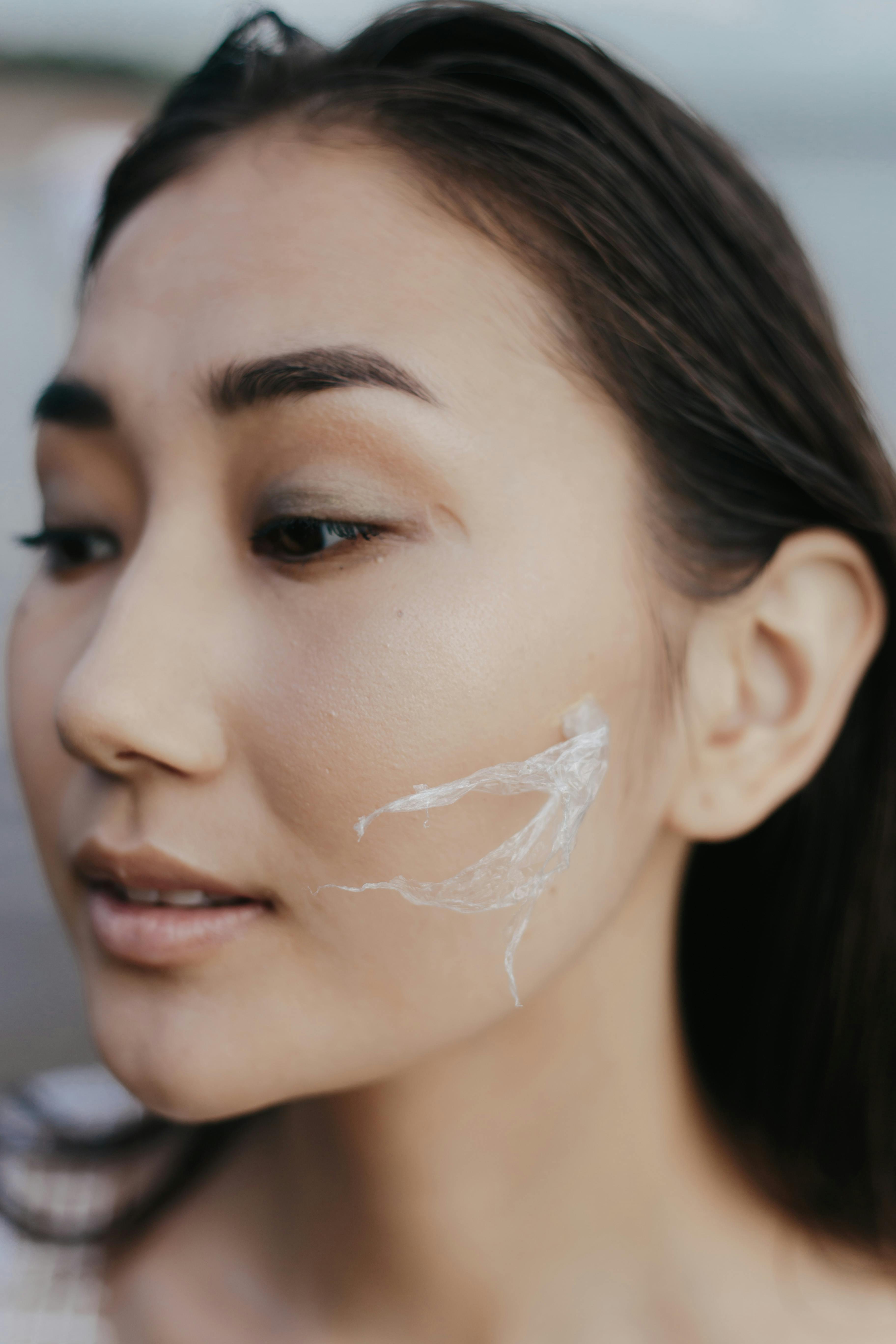 Woman with Plastic on Her Cheek · Free Stock Photo