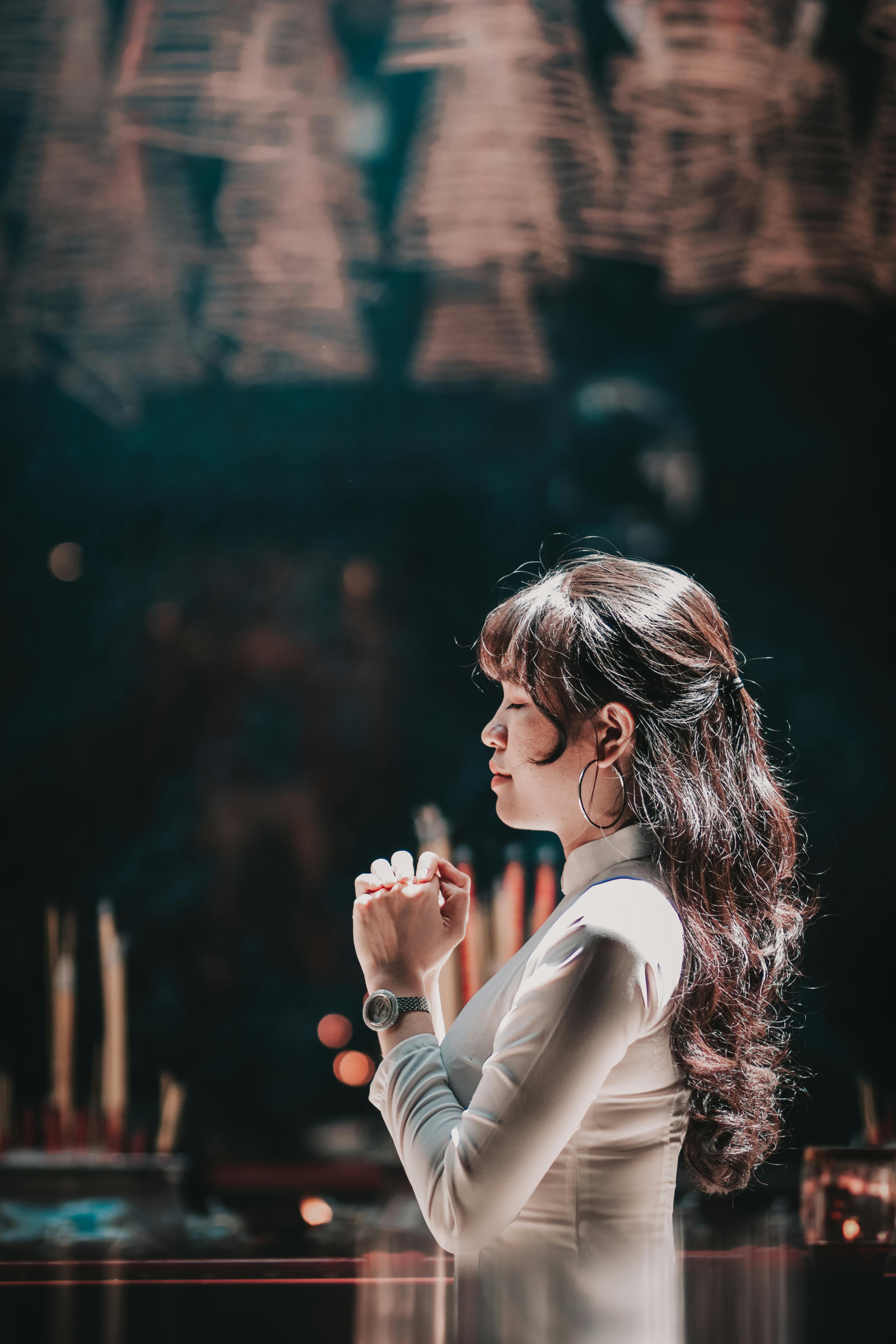 Side View of Woman Praying · Free Stock Photo