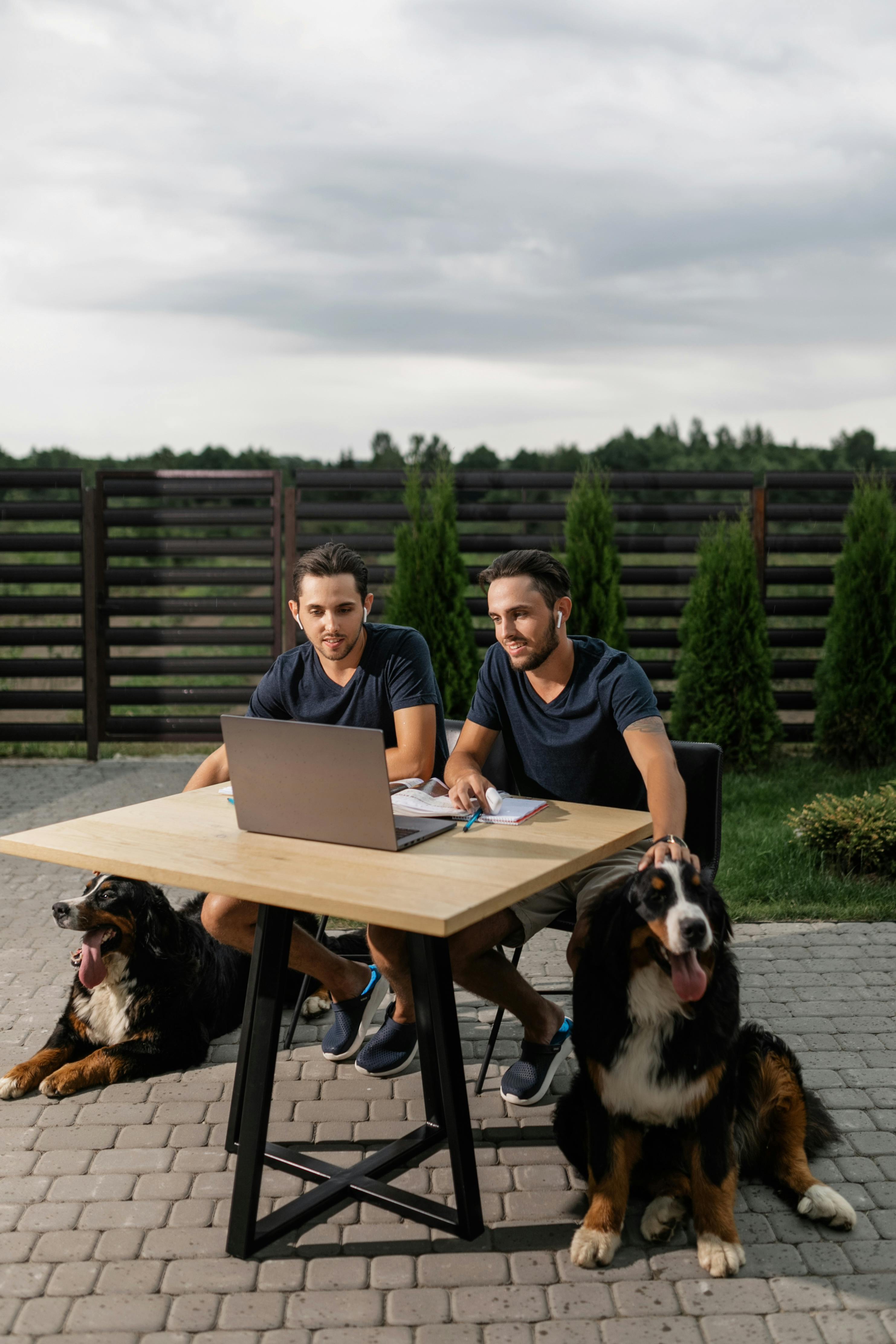 Men Sitting at Table with Laptop · Free Stock Photo