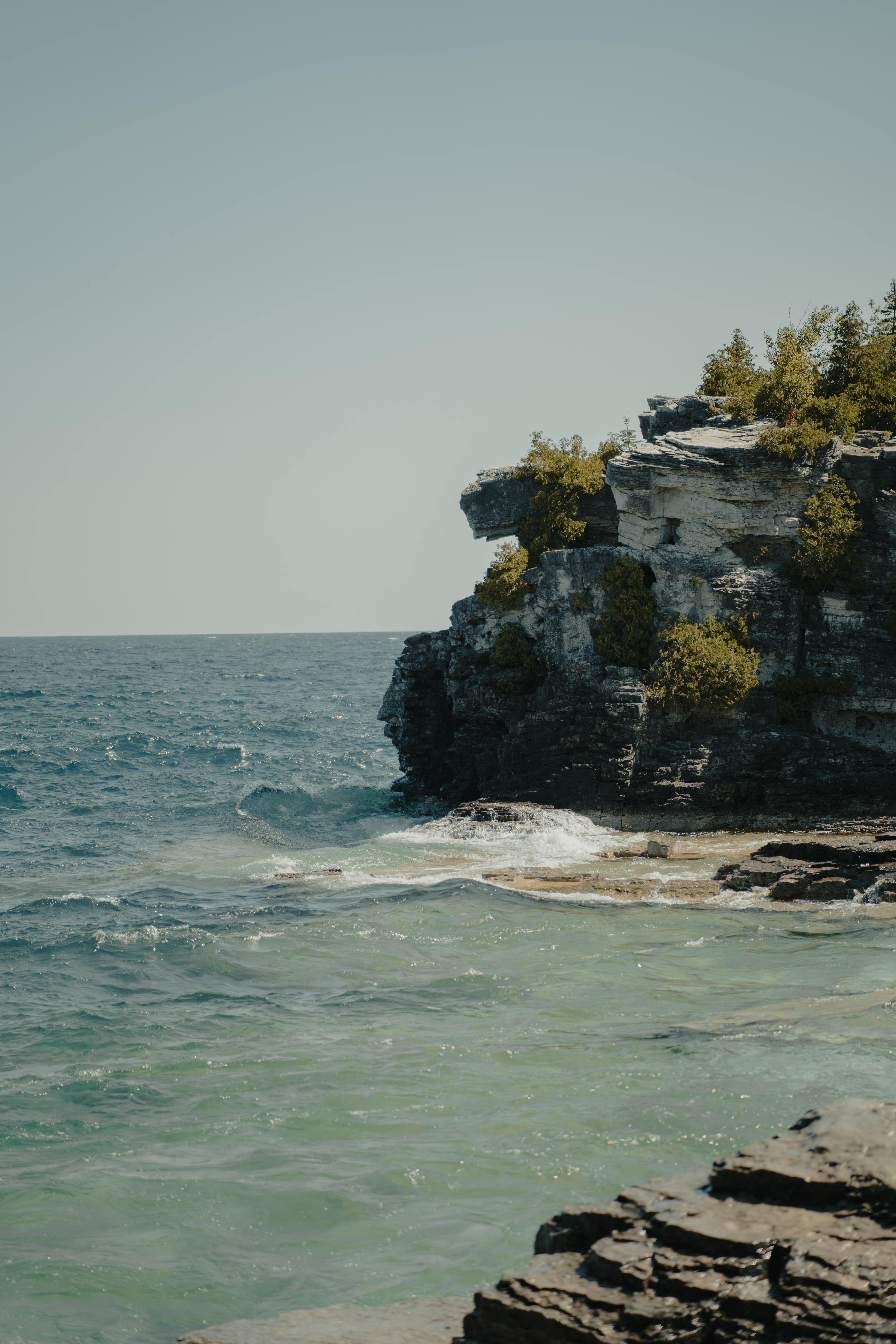 A Rock Formation on the Sea · Free Stock Photo