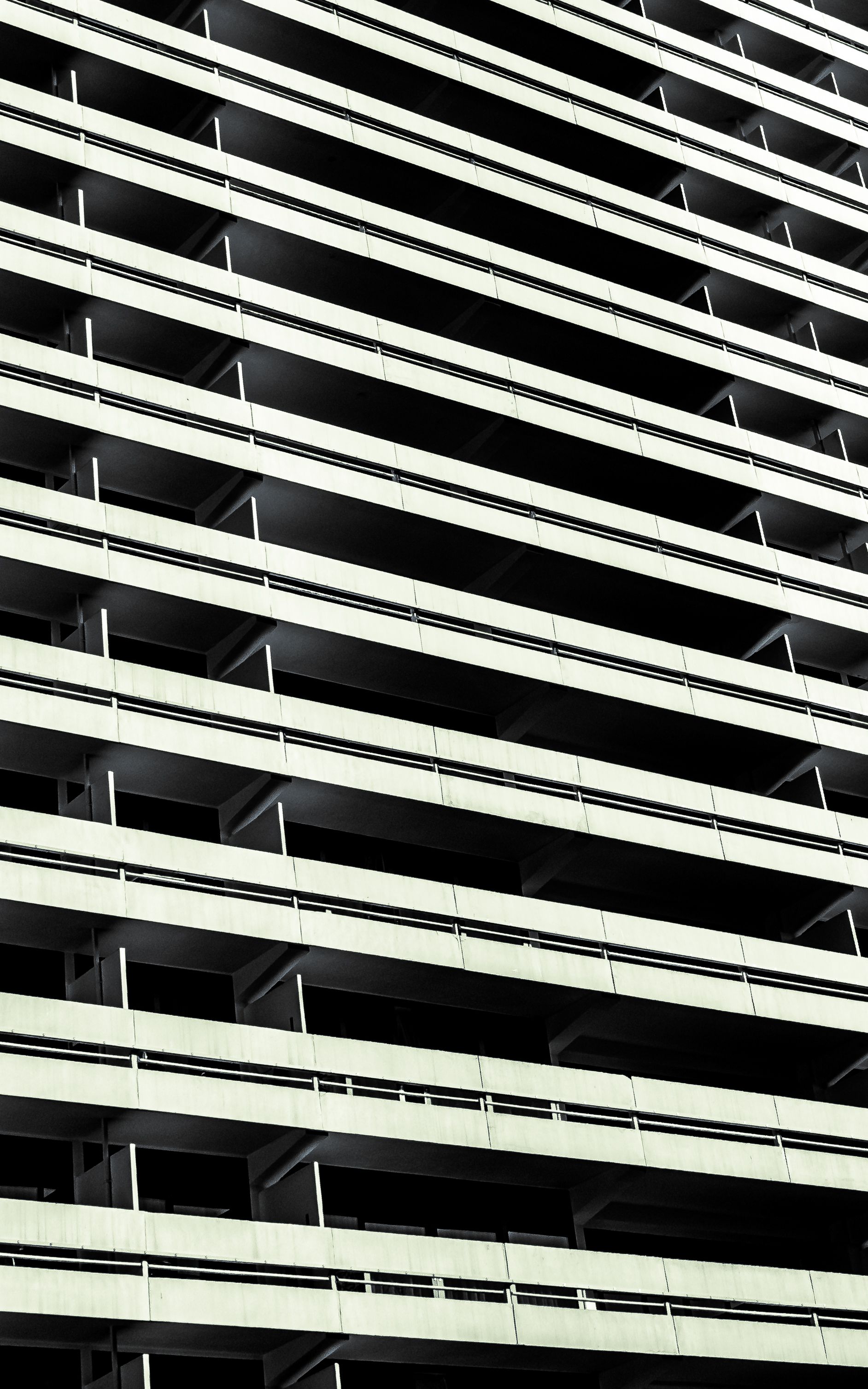 Grayscale Photo of a Modern Building · Free Stock Photo