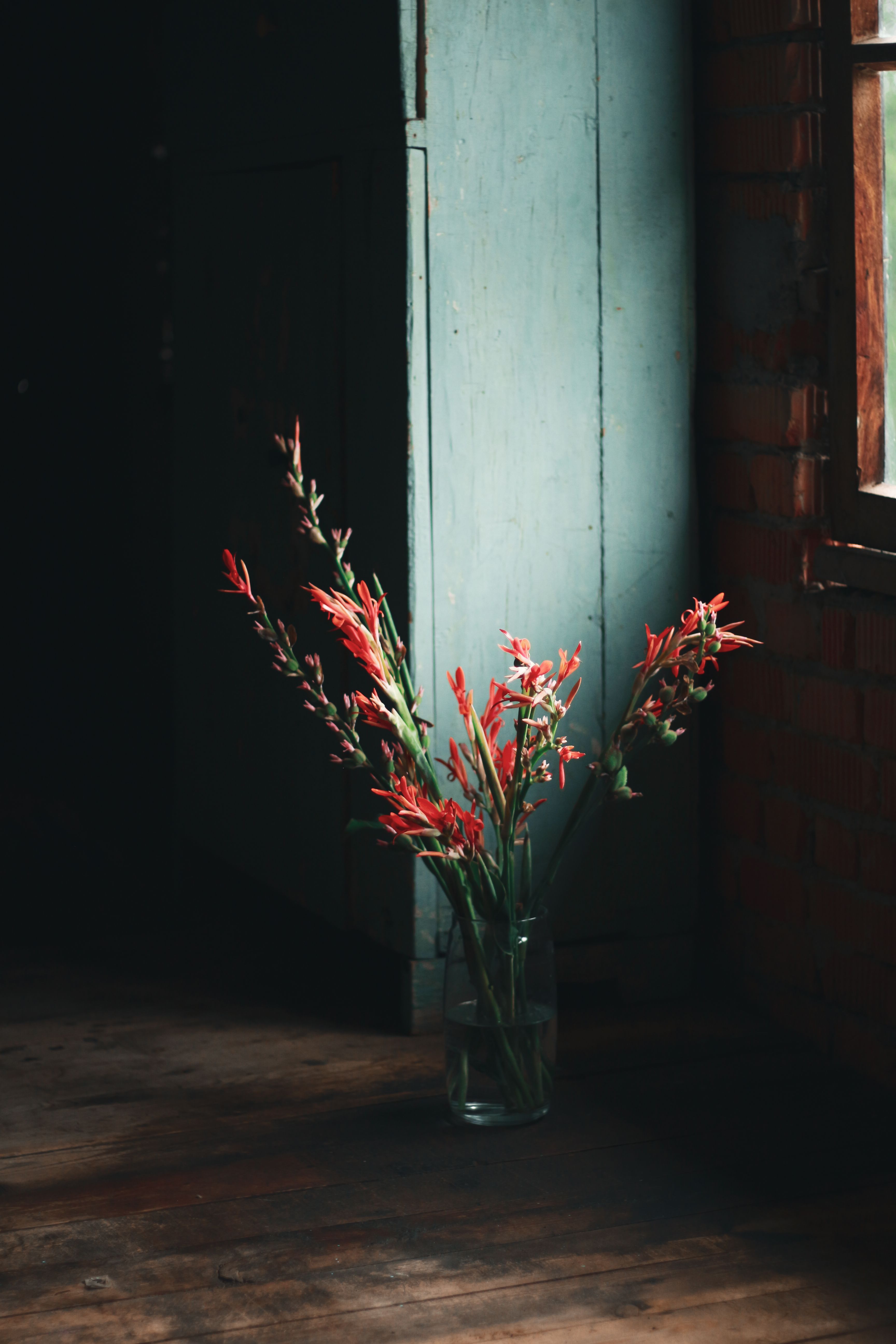 A Candle and Glass Vase Reflection on a Standing Mirror · Free Stock Photo