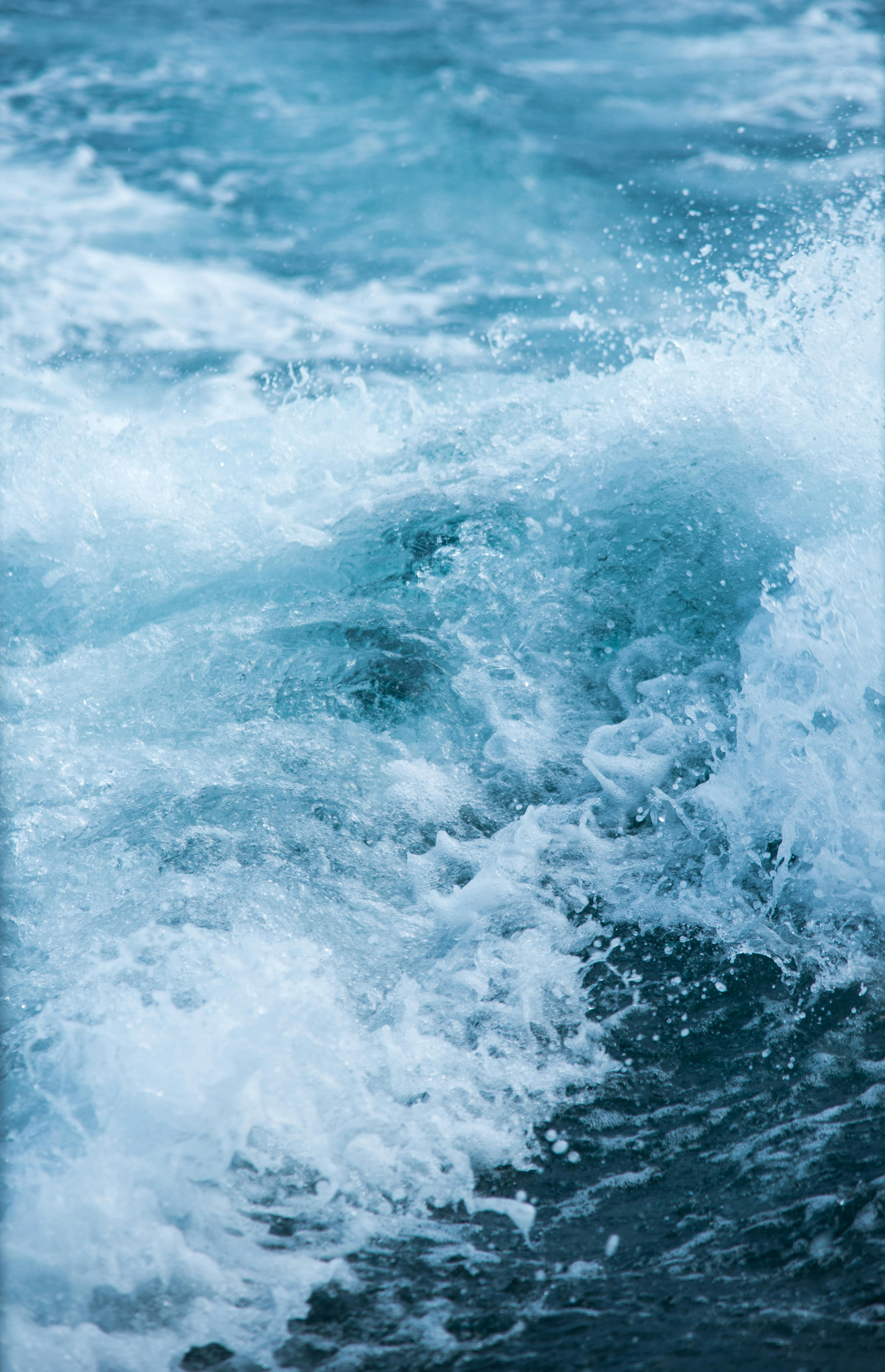 A Close-Up Shot of a Wave Crashing · Free Stock Photo