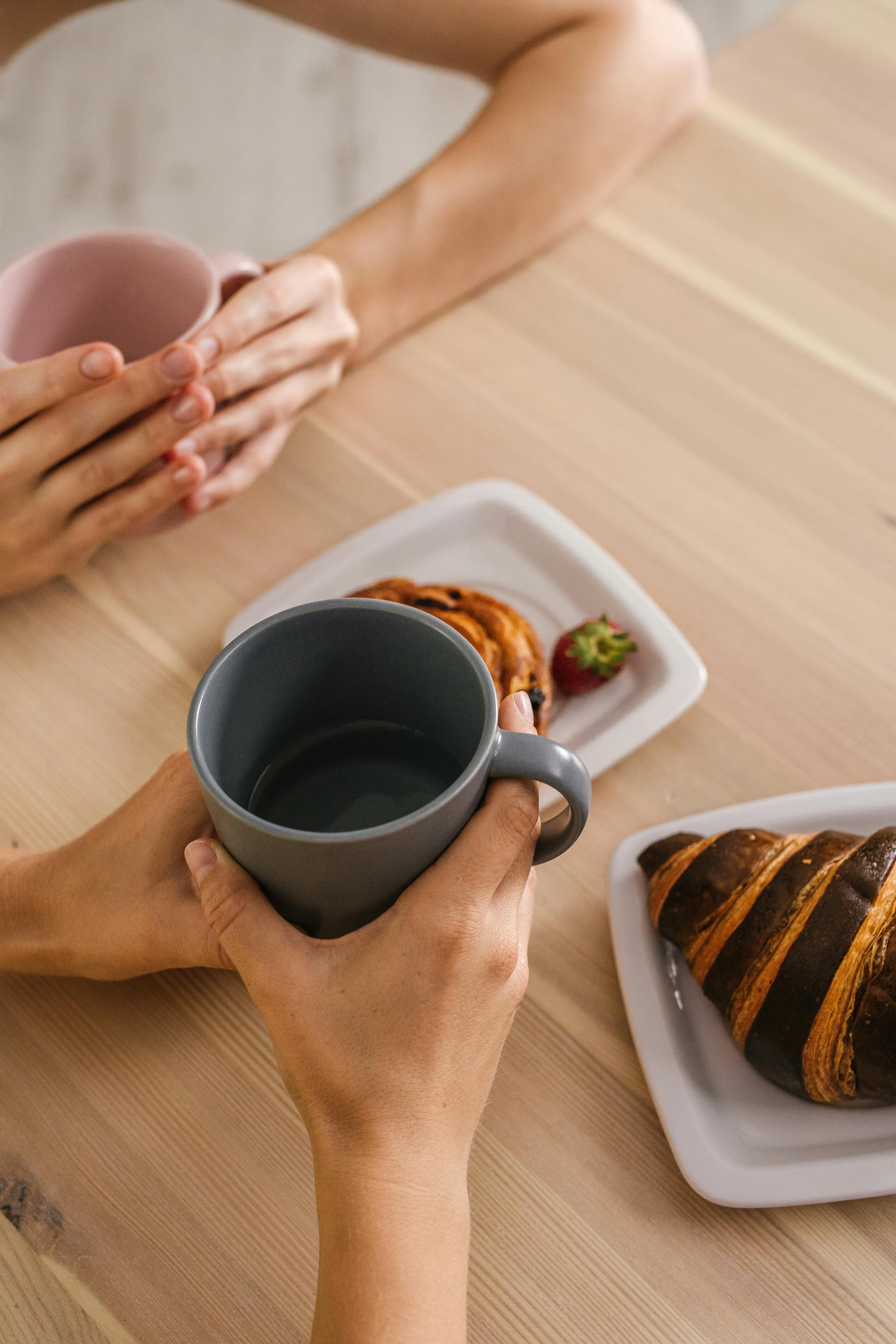 A Person Holding a Cup · Free Stock Photo