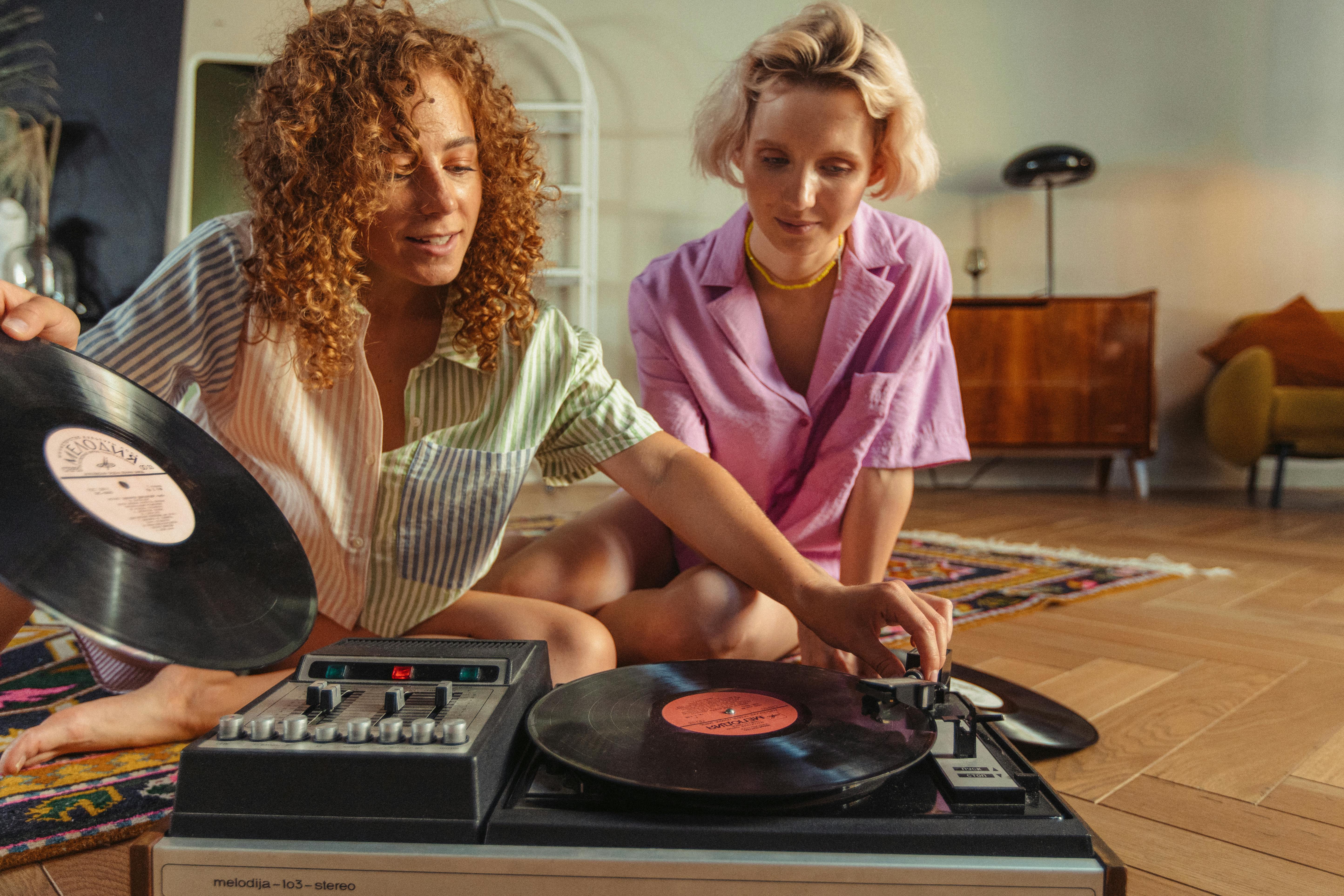 Women Playing Vinyl Records · Free Stock Photo