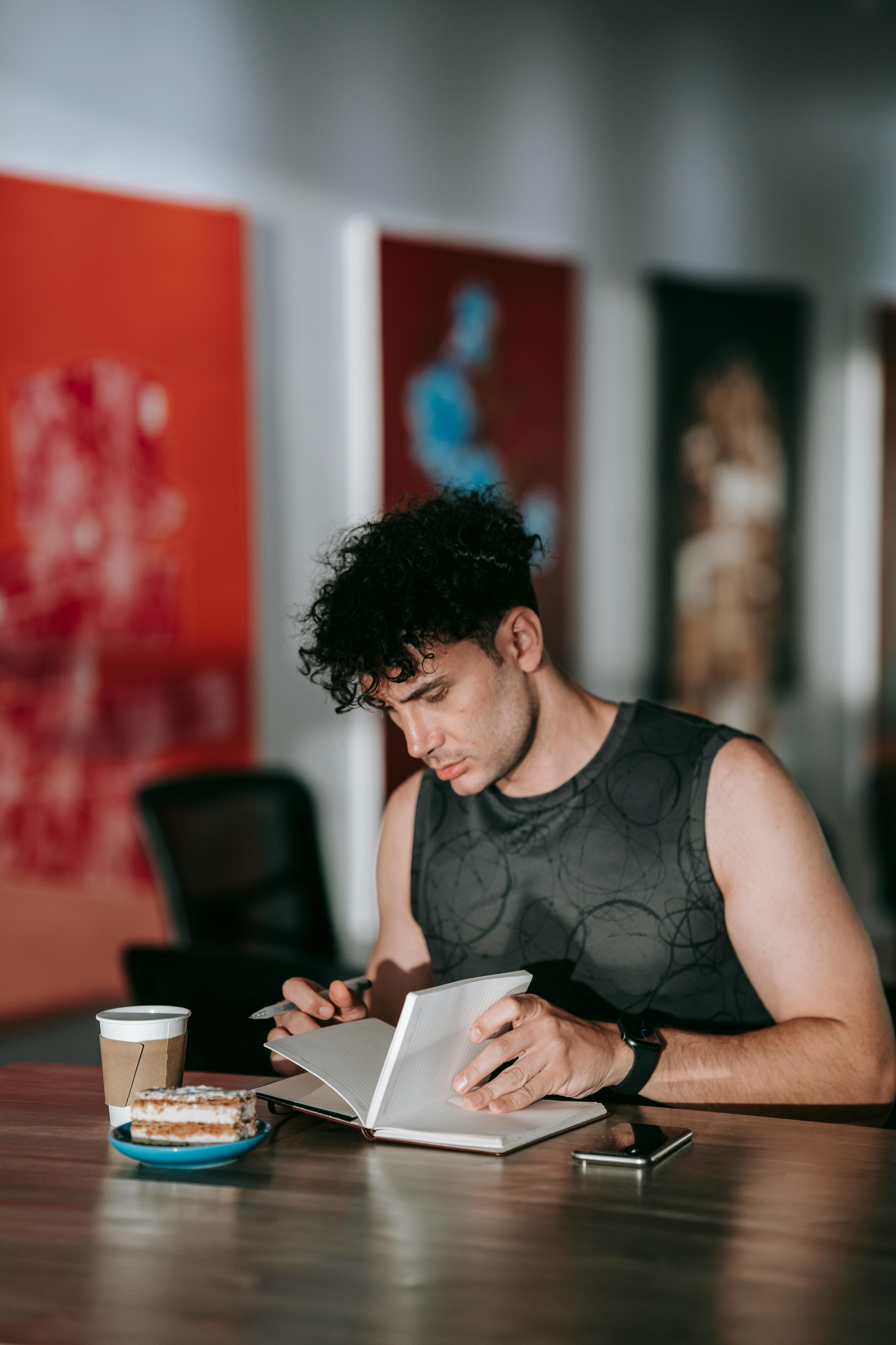 A Man Writing in a Journal · Free Stock Photo
