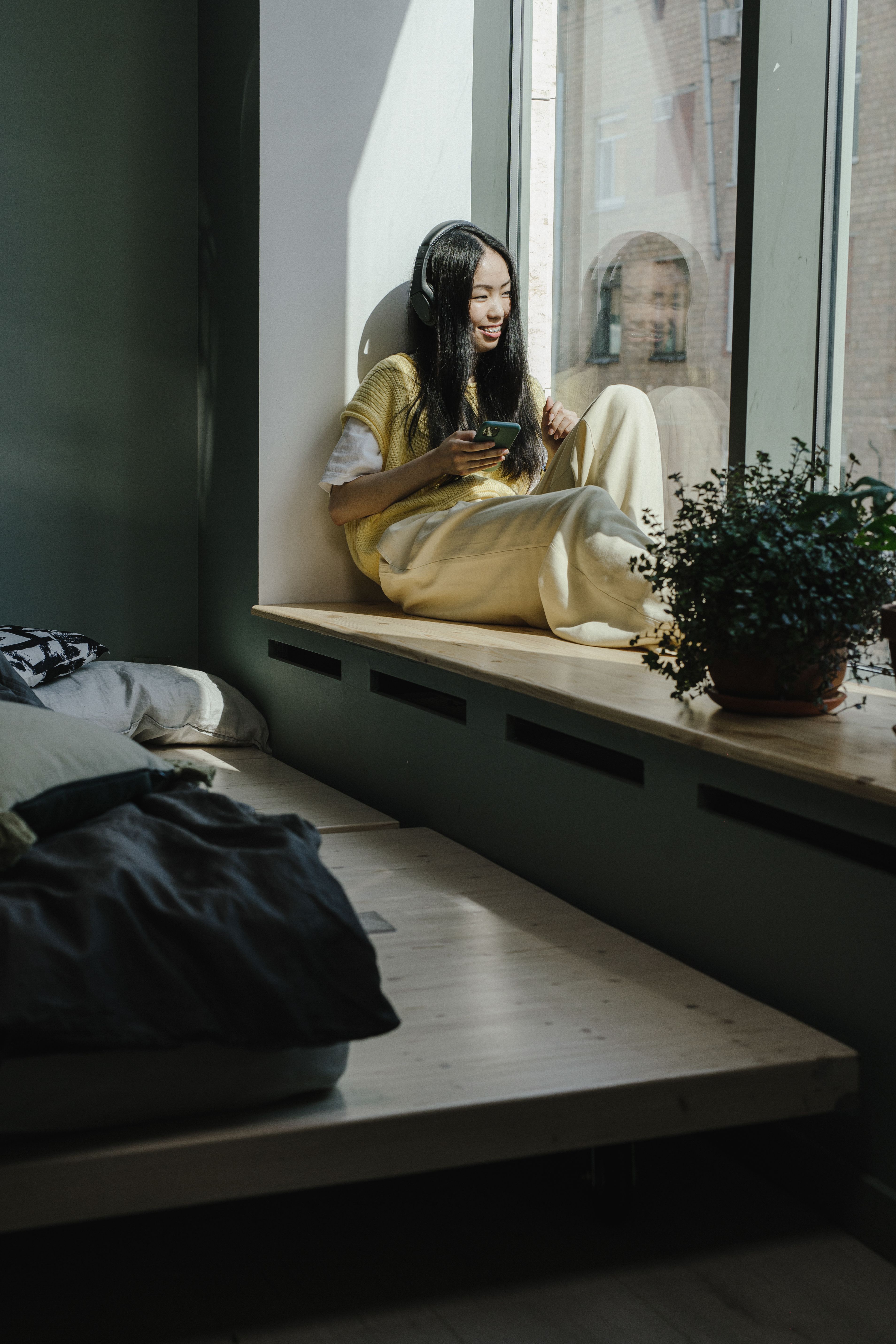 A Woman Sitting Near the Window · Free Stock Photo