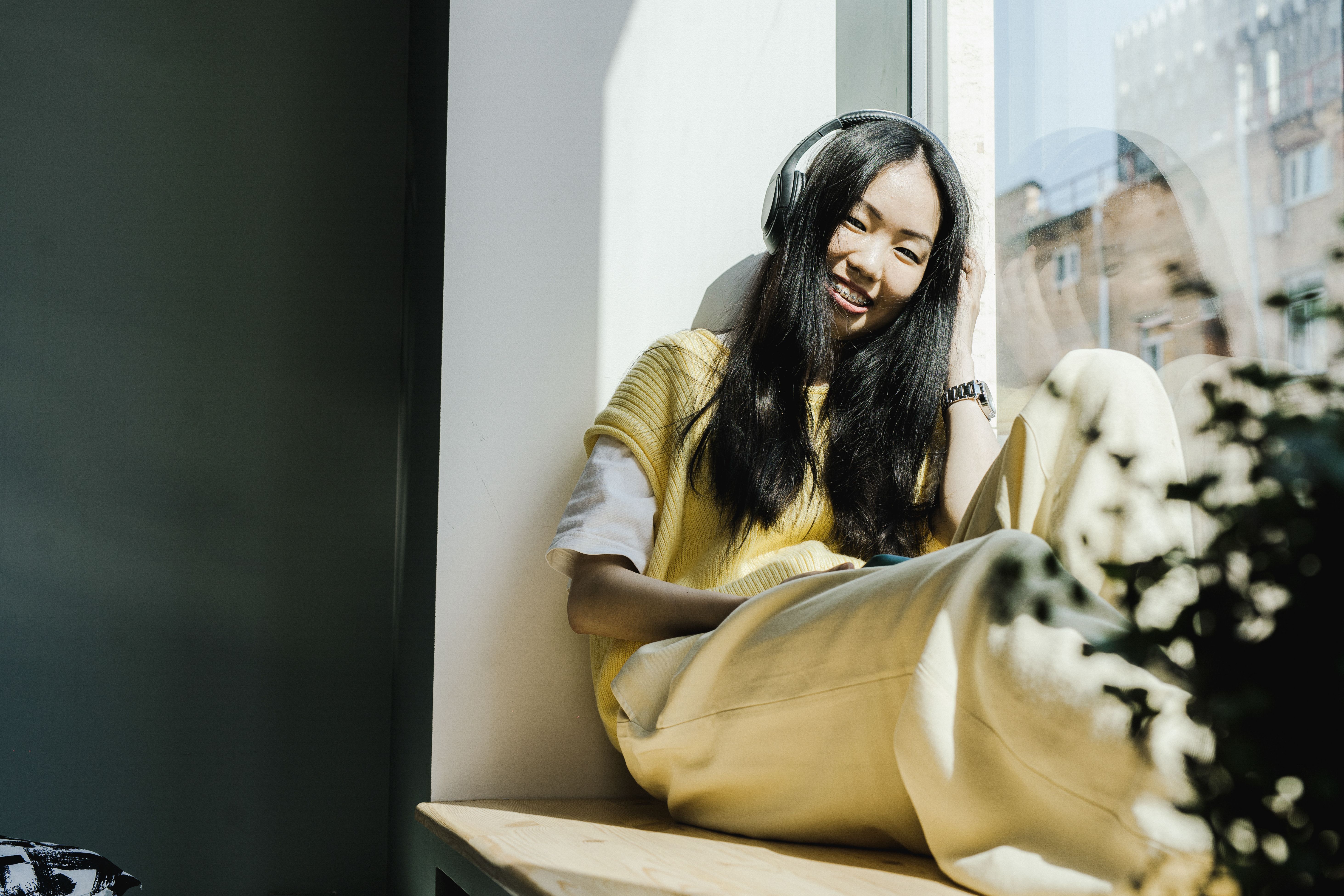 A Woman Sitting Near the Window · Free Stock Photo