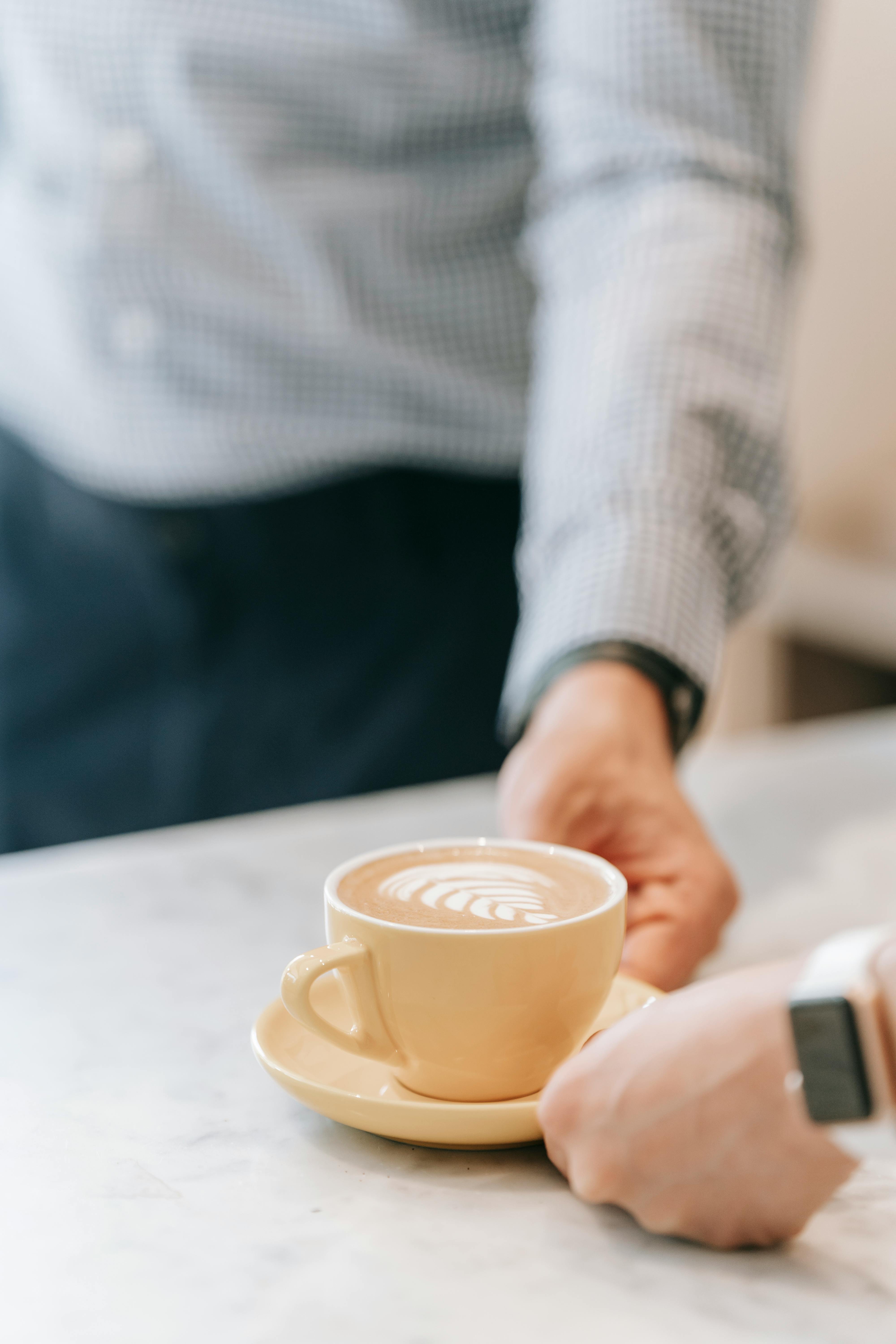 A Person Holding a Cup · Free Stock Photo