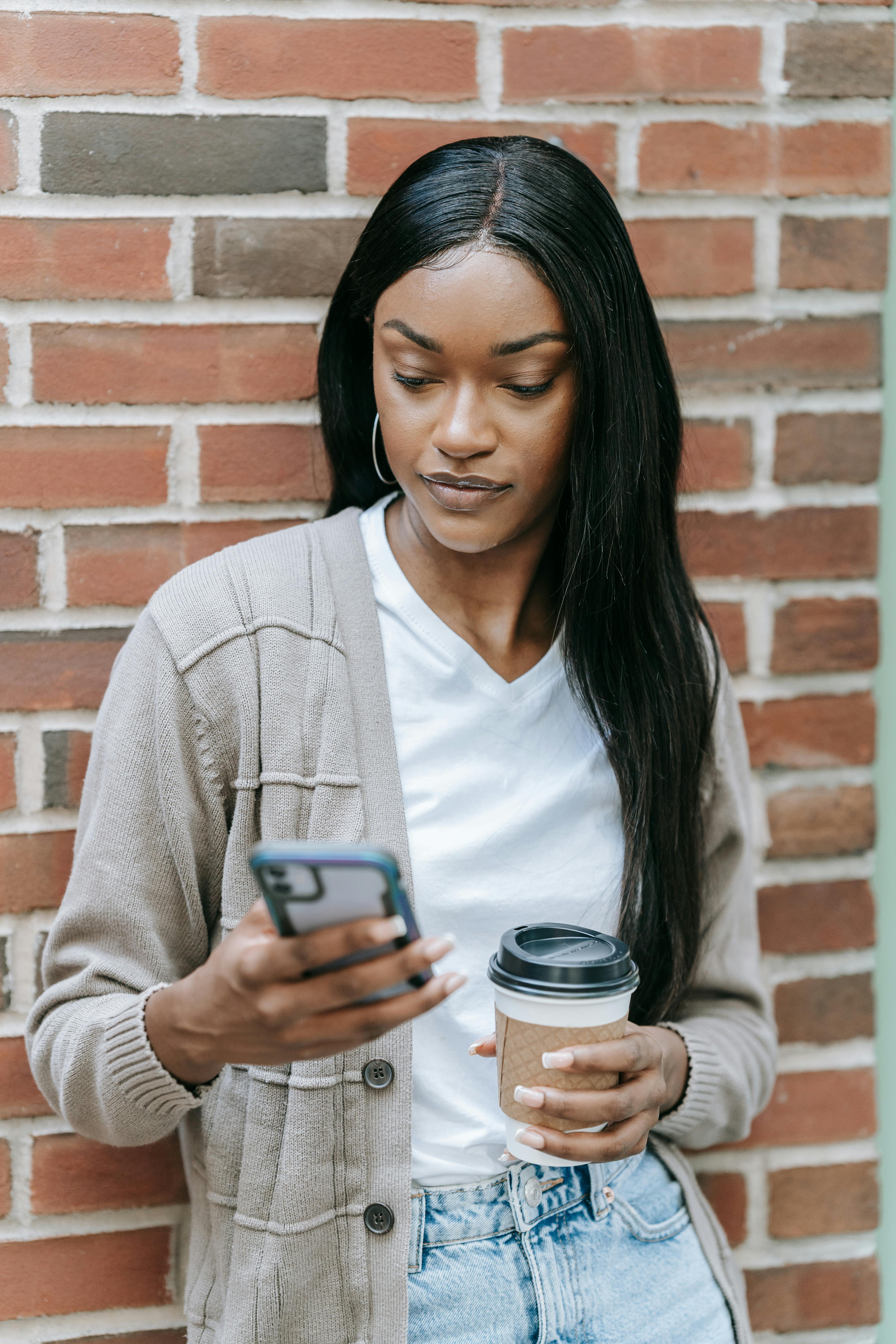 A Fine Looking Barista Holding Paper Cups while Looking Afar · Free ...