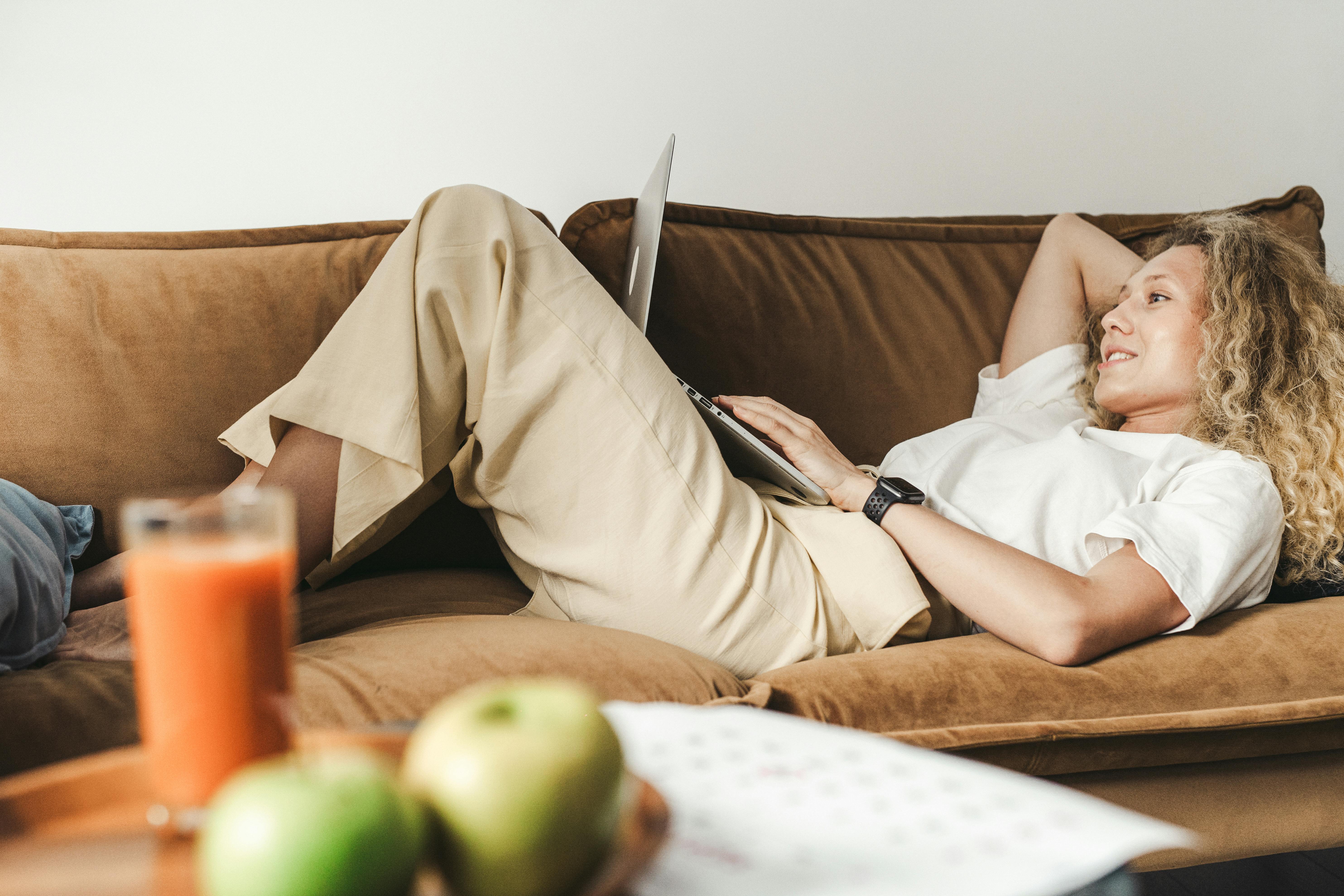A Woman Lying on the Couch · Free Stock Photo