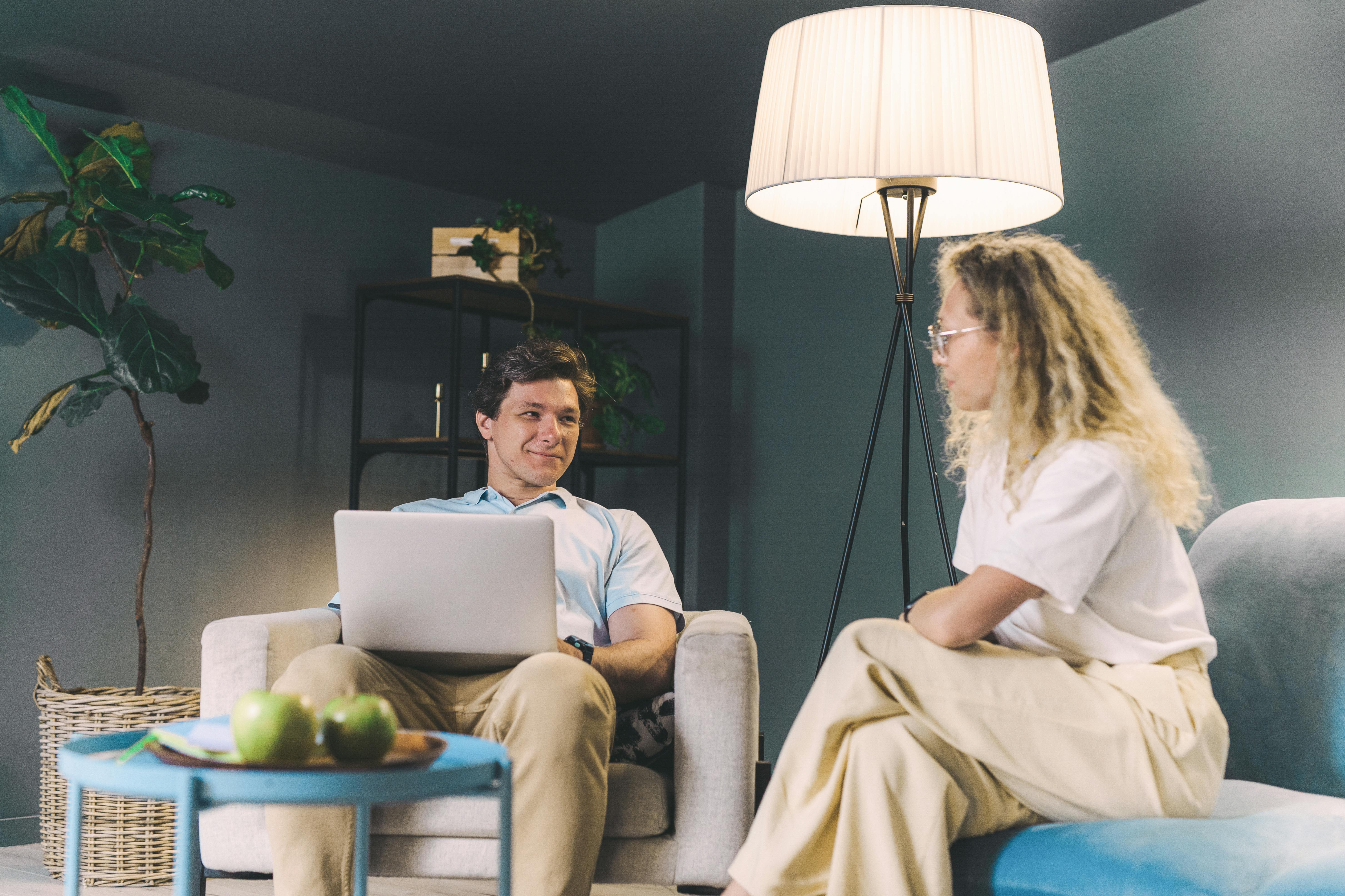 Couple Talking in a Living Room · Free Stock Photo