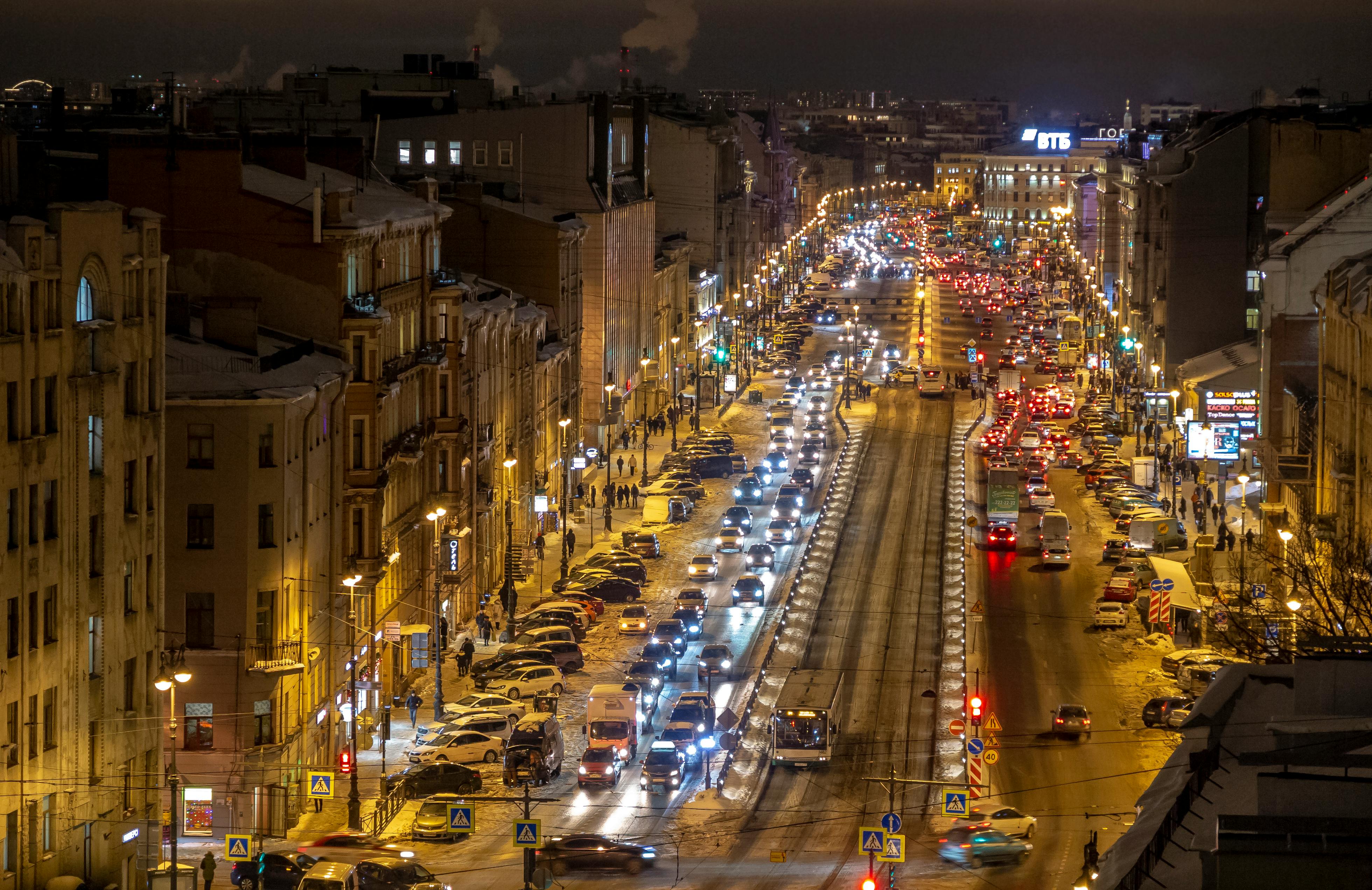 Vehicles Traveling on City Road at Night · Free Stock Photo