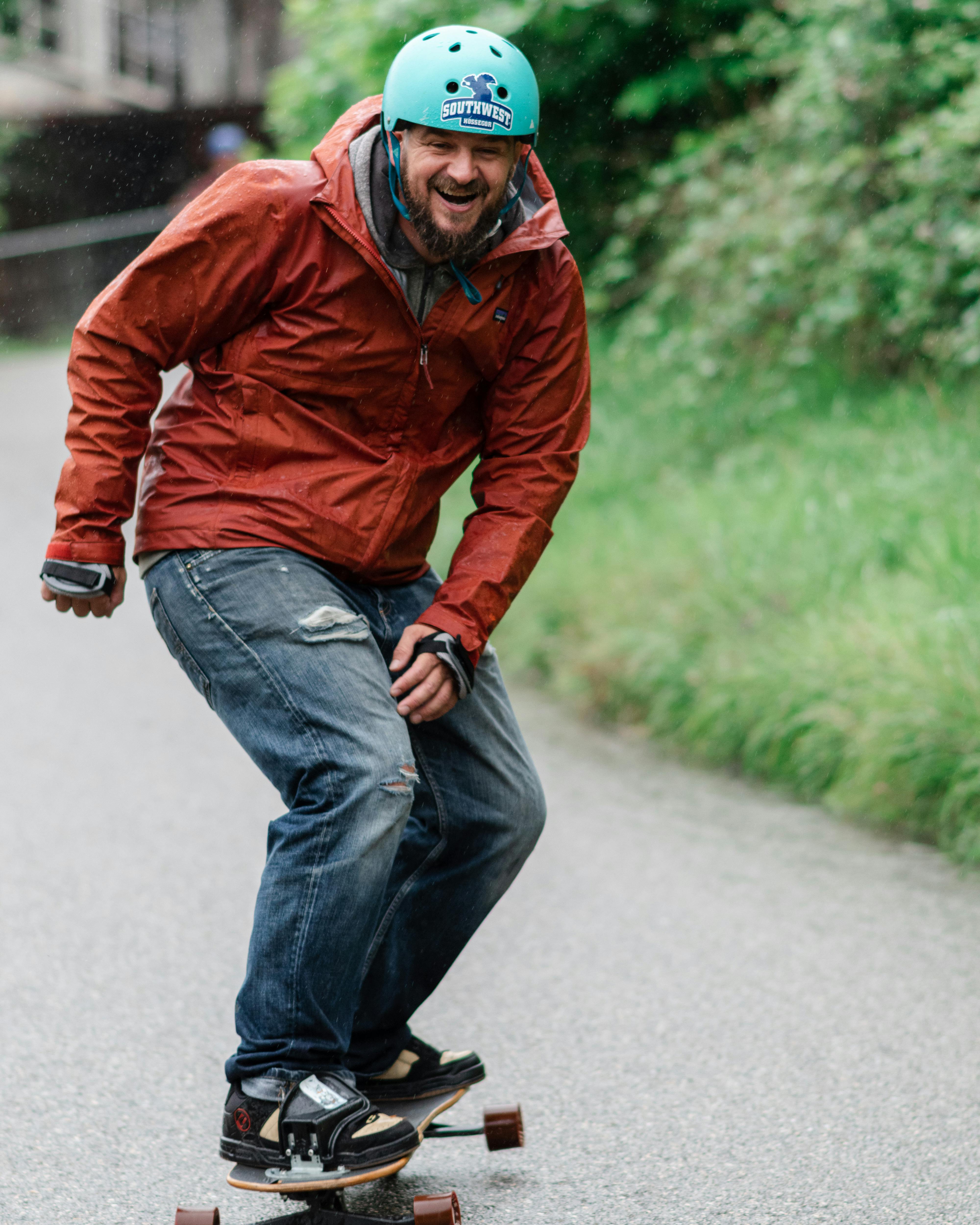 Man Riding Skateboard on Road · Free Stock Photo