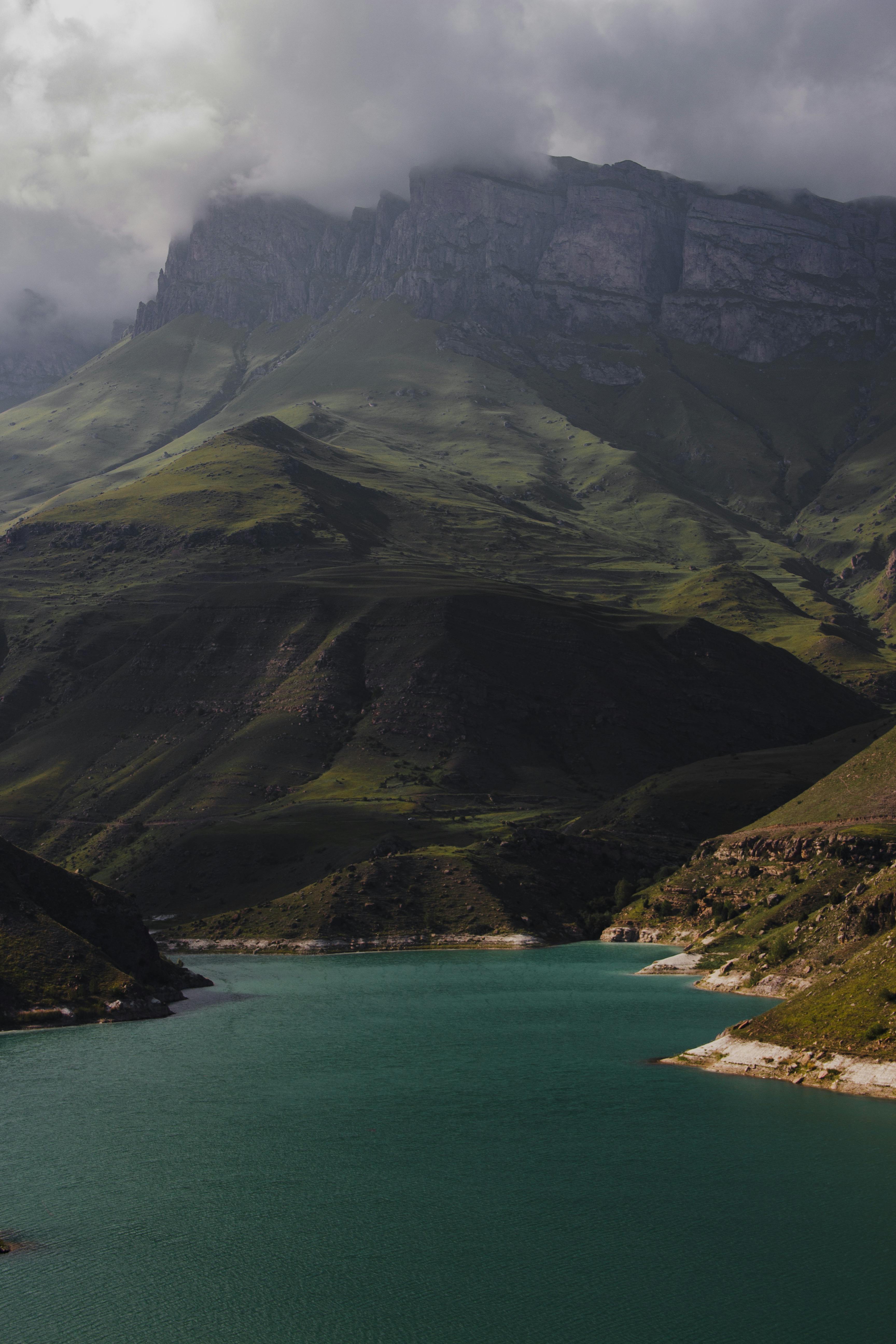 Mountain Near Body of Water · Free Stock Photo