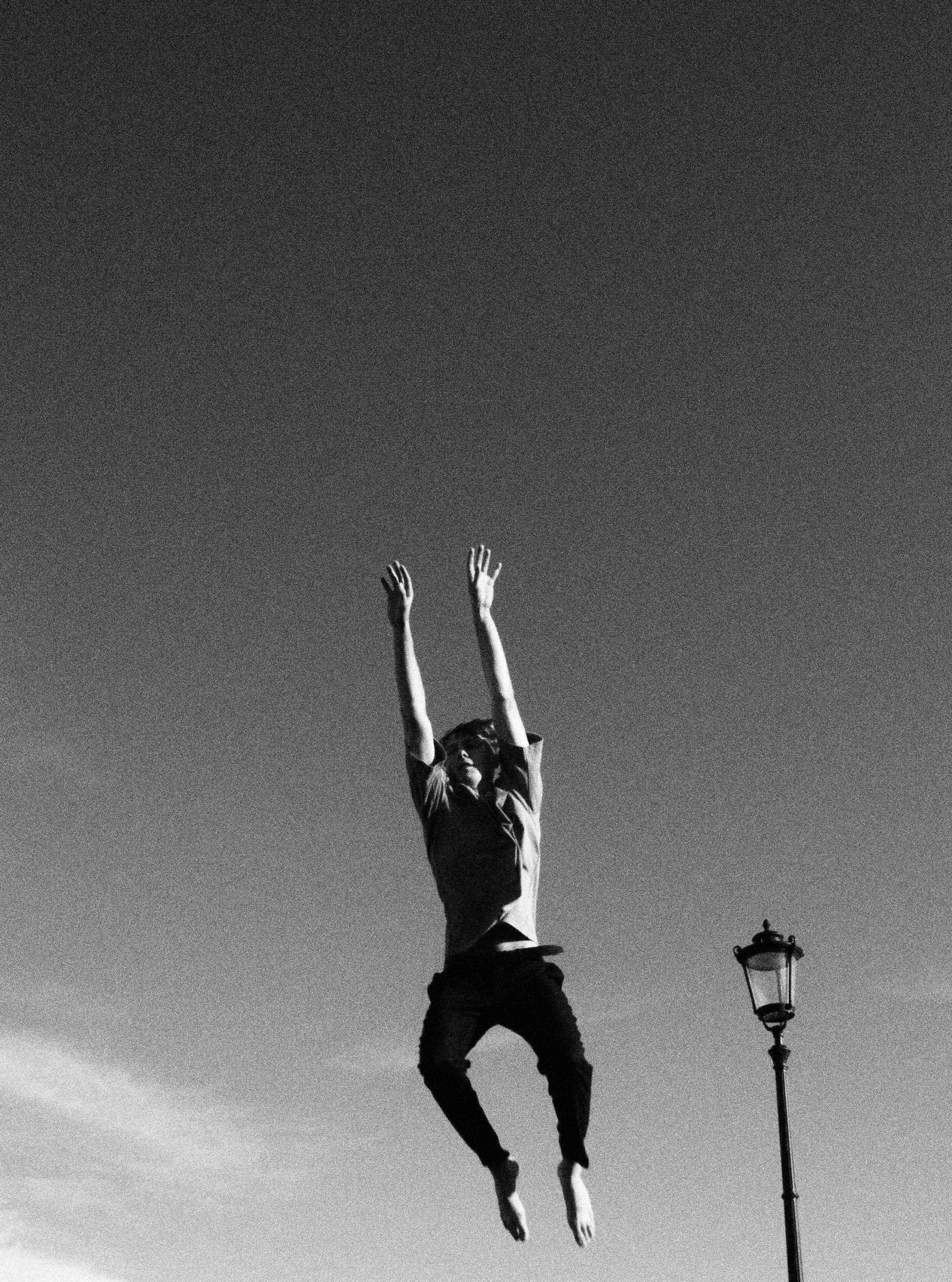Grayscale Photo of Man Jumping · Free Stock Photo