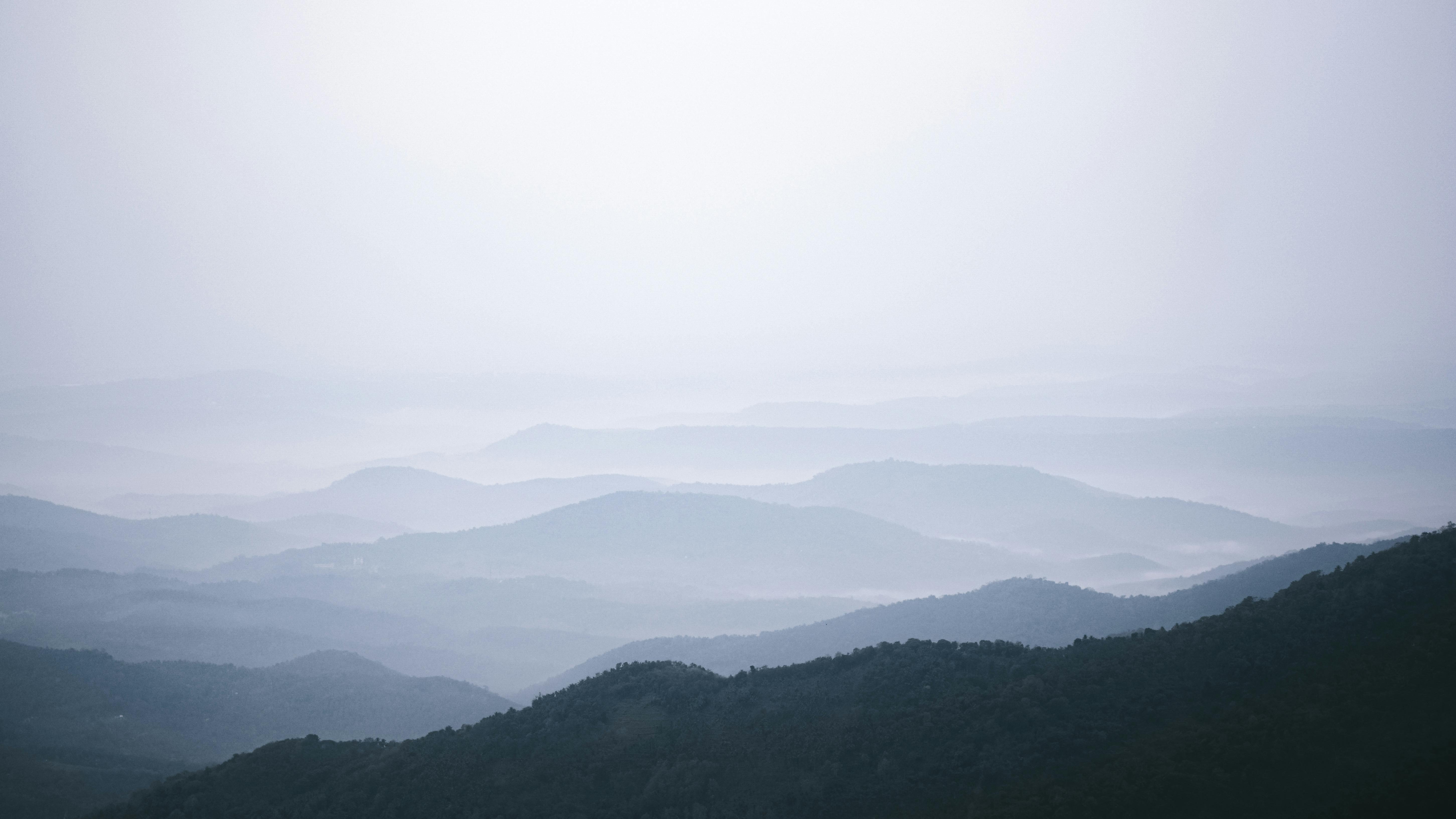 Hazy Mountain Ranges under Gloomy Sky · Free Stock Photo