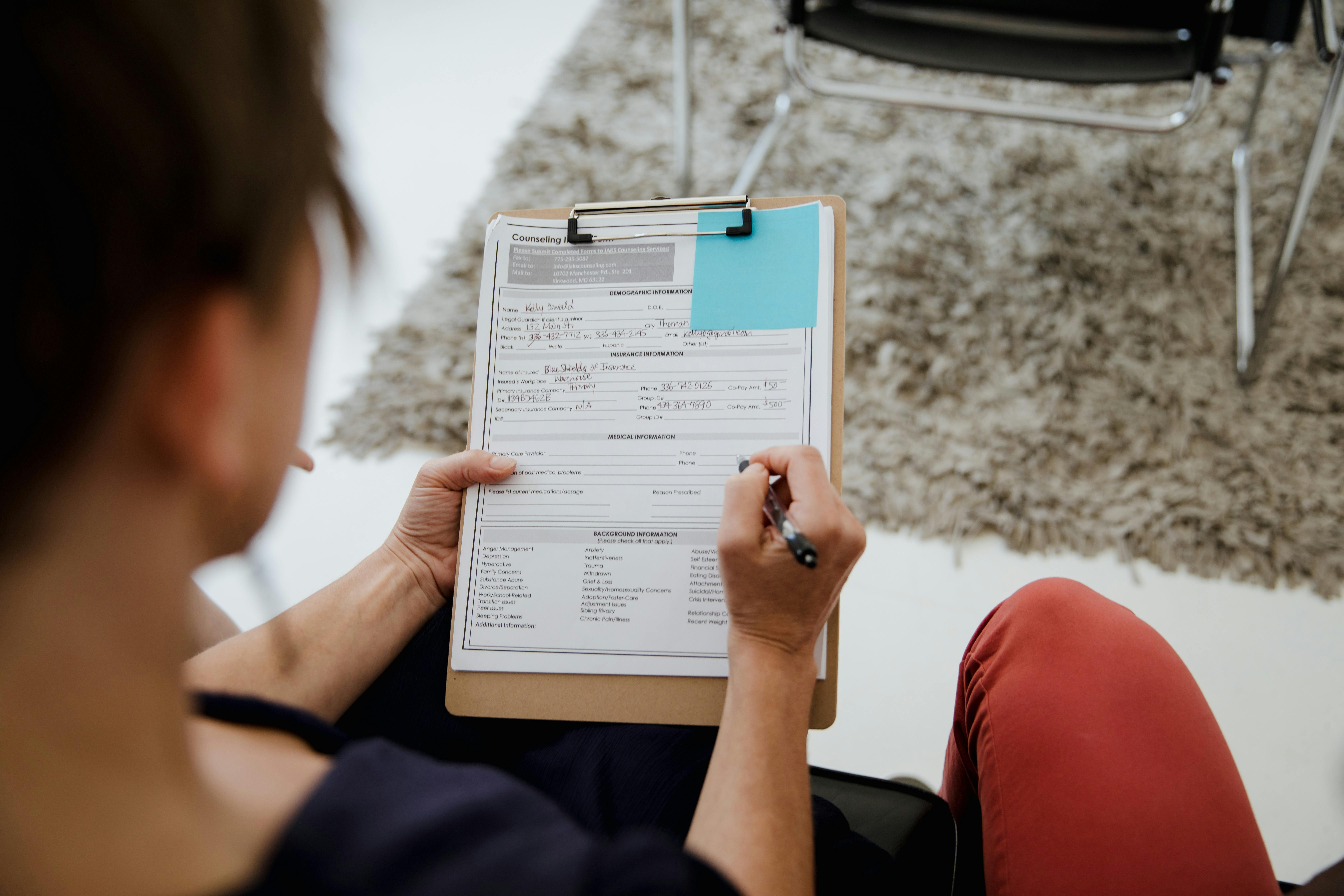 Woman Signing Documents · Free Stock Photo