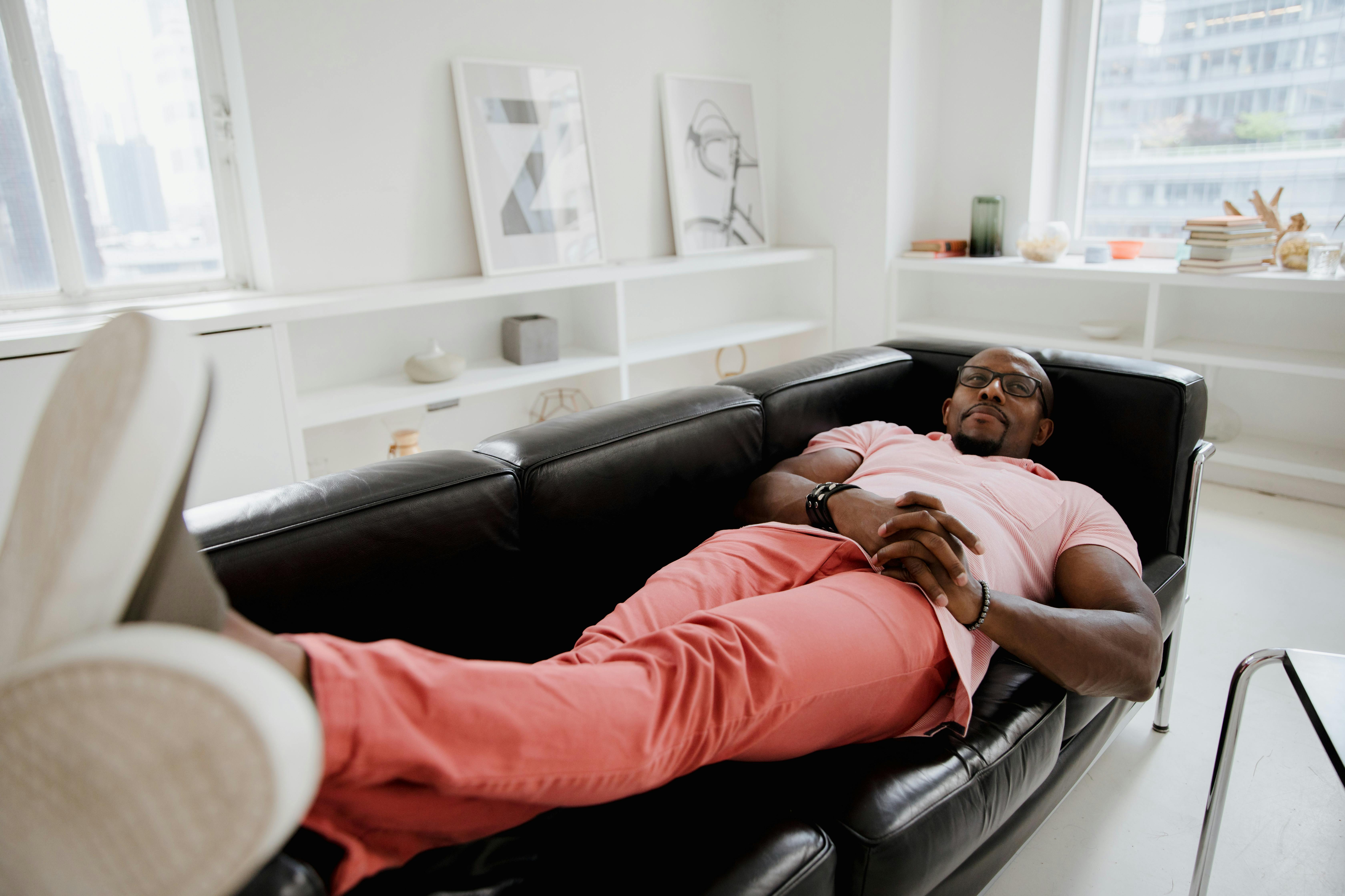 A Man Lying on the Couch · Free Stock Photo