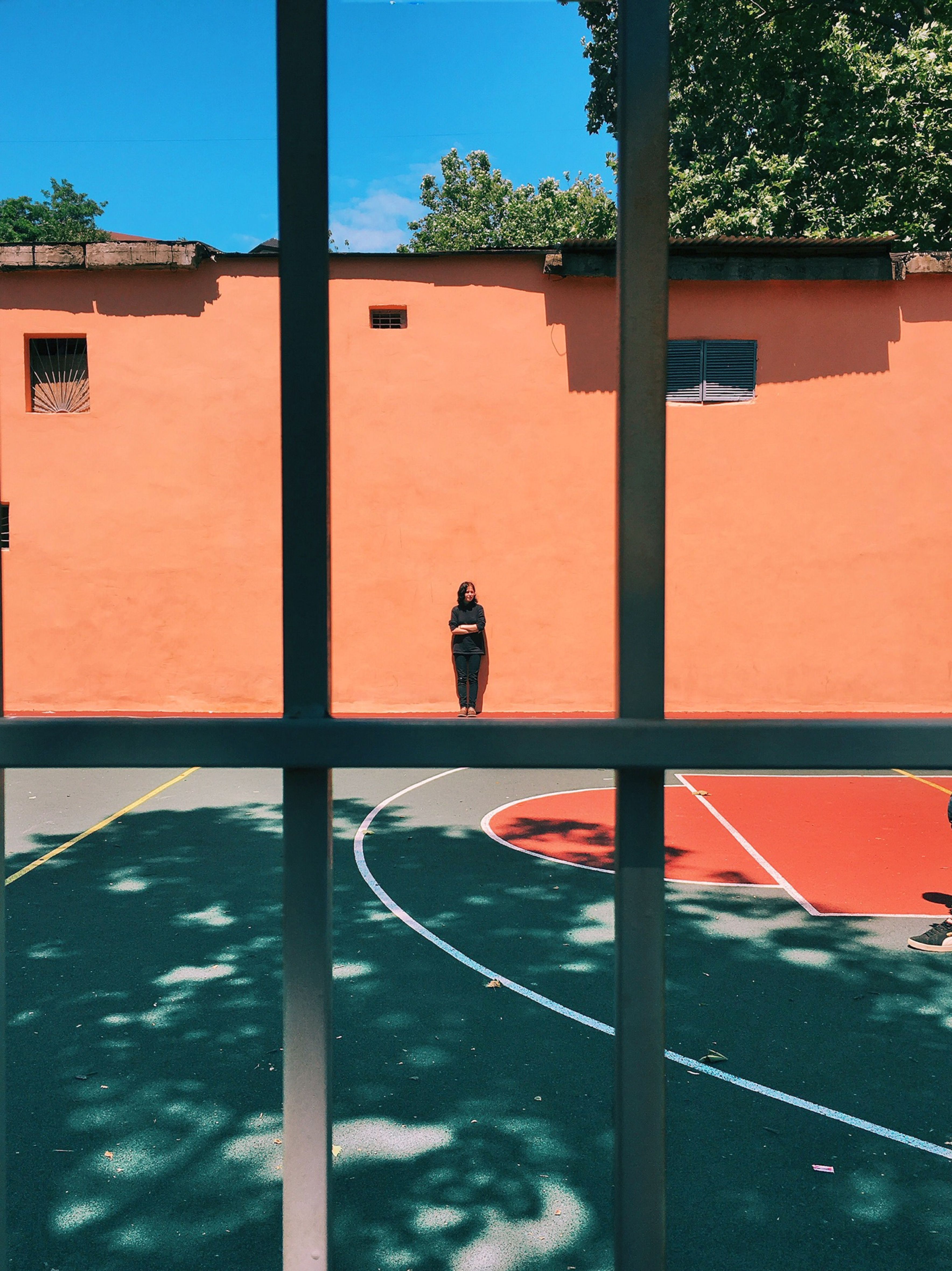Woman Standing by Wall · Free Stock Photo