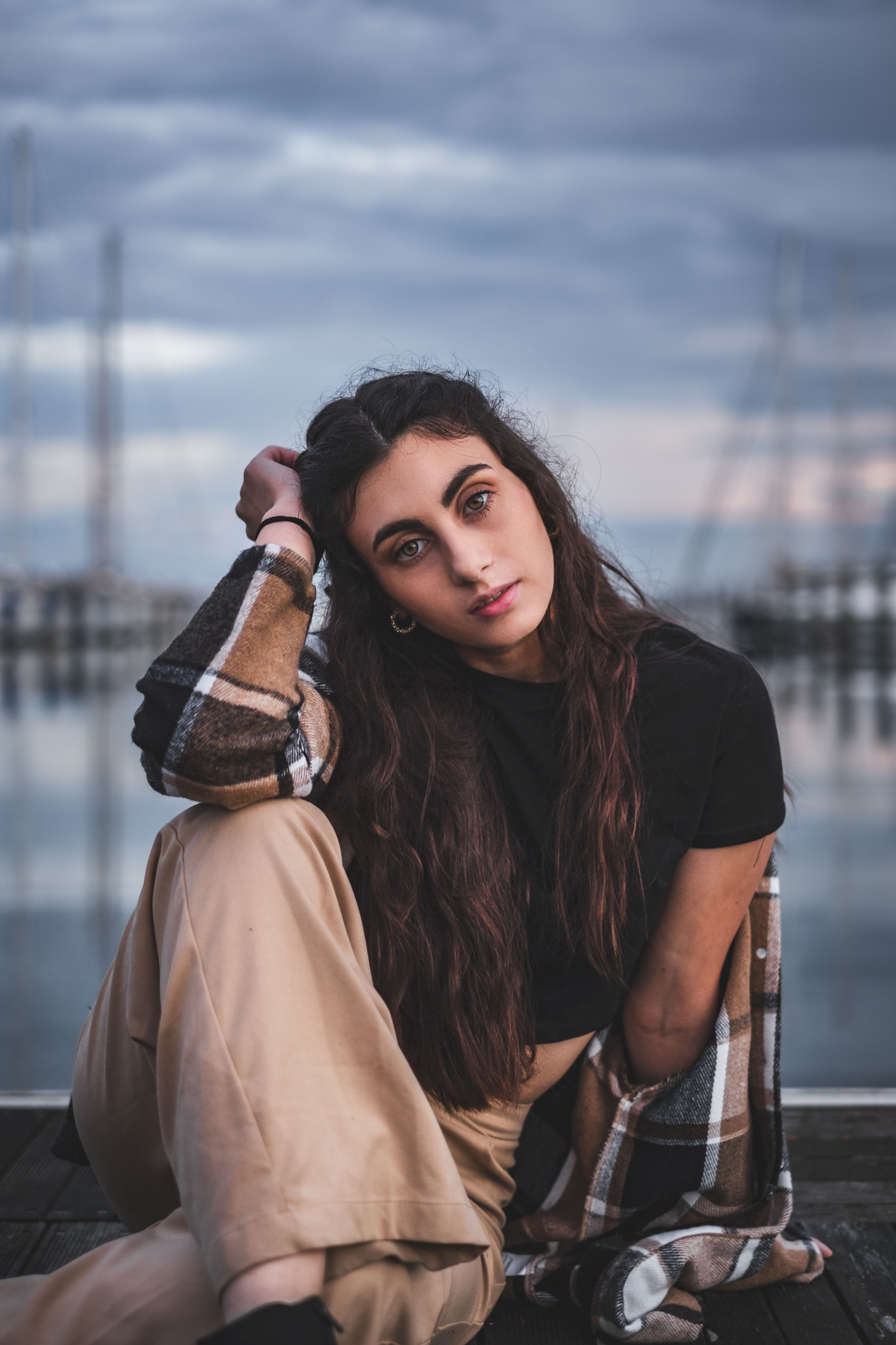 Beautiful Woman in a White Crop Top Shirt Posing with Her Hand on Her ...