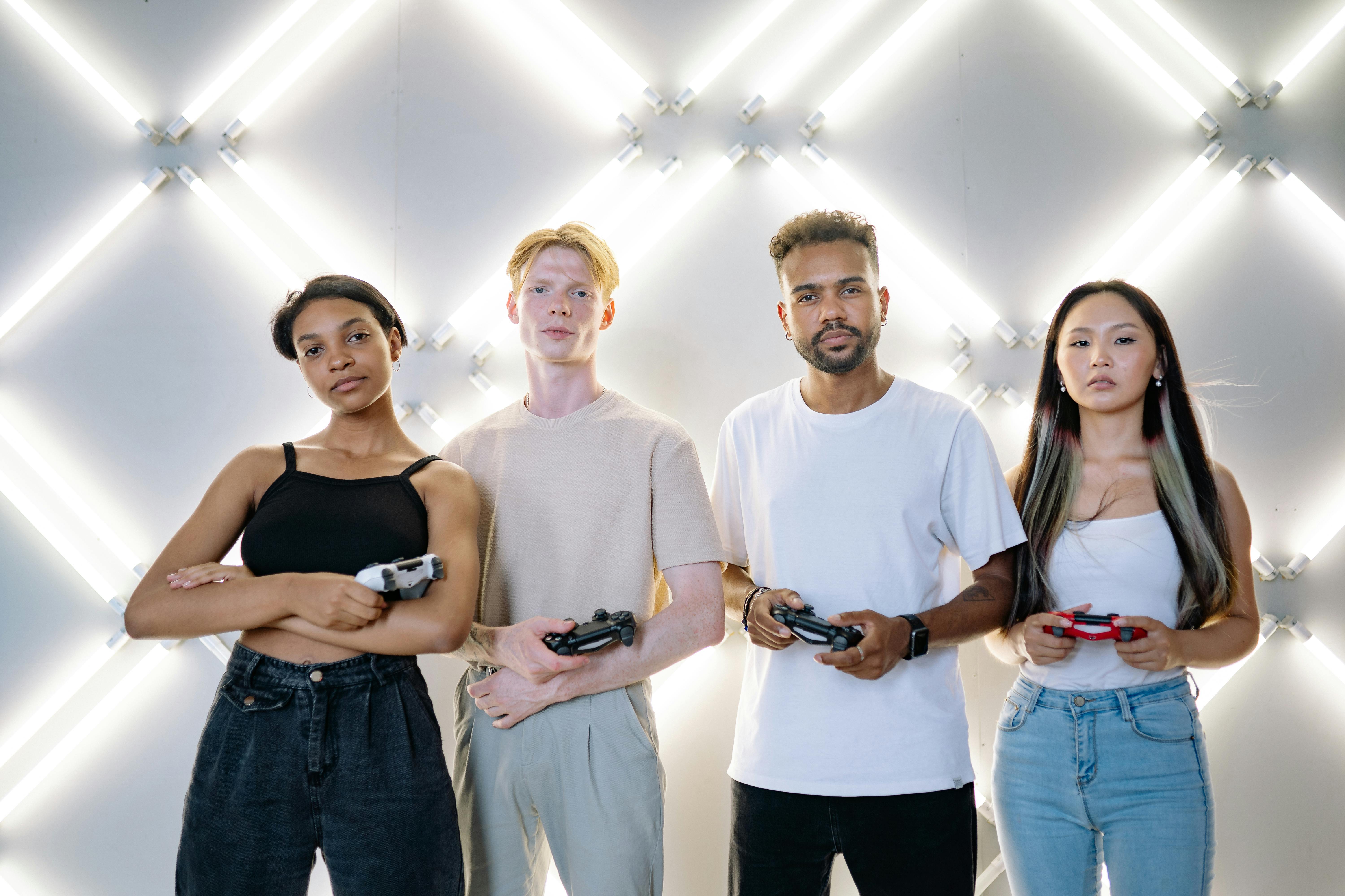 A Group of Friends Holding Game Consoles · Free Stock Photo