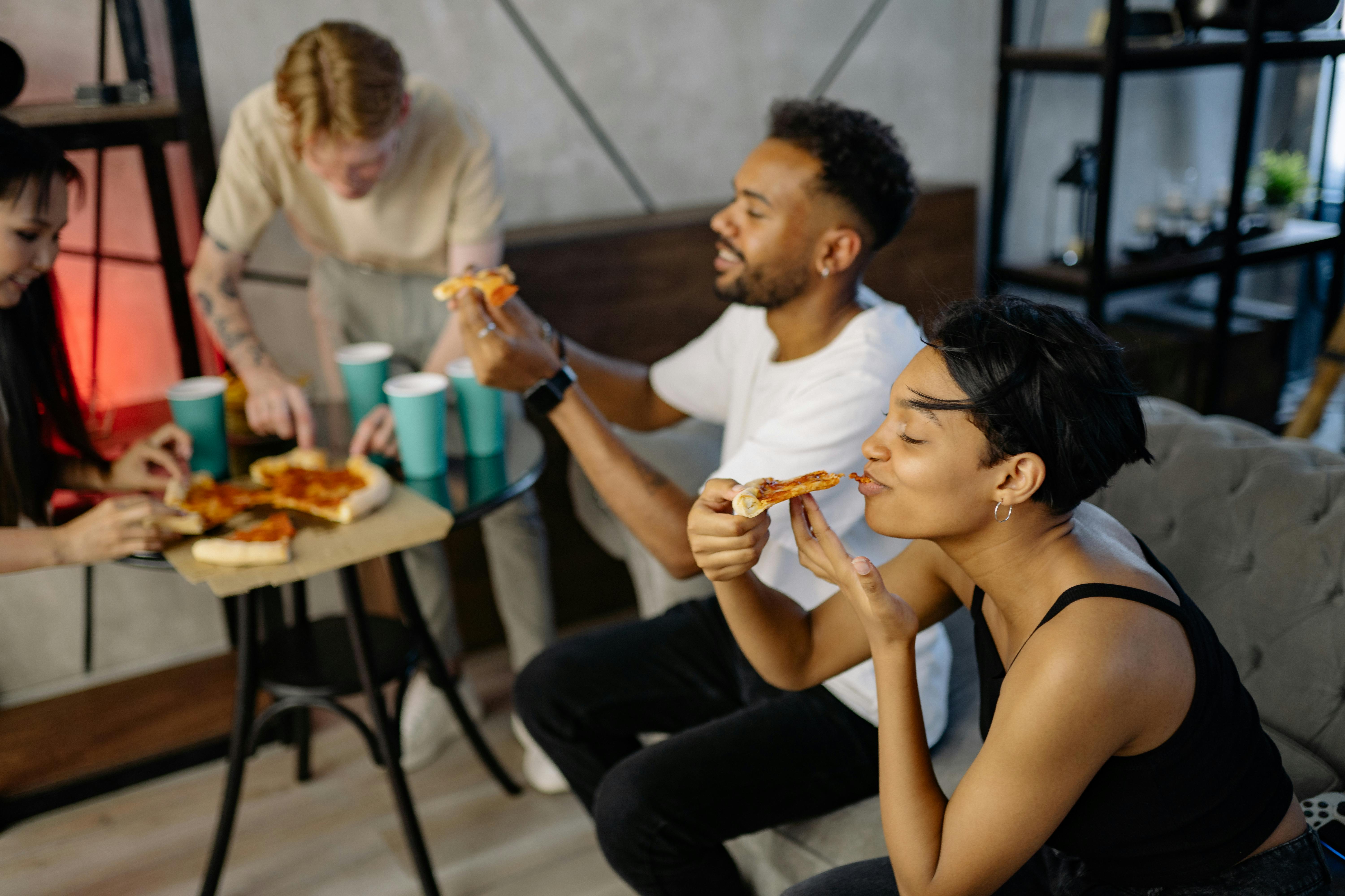 A Woman Eating on the Table · Free Stock Photo