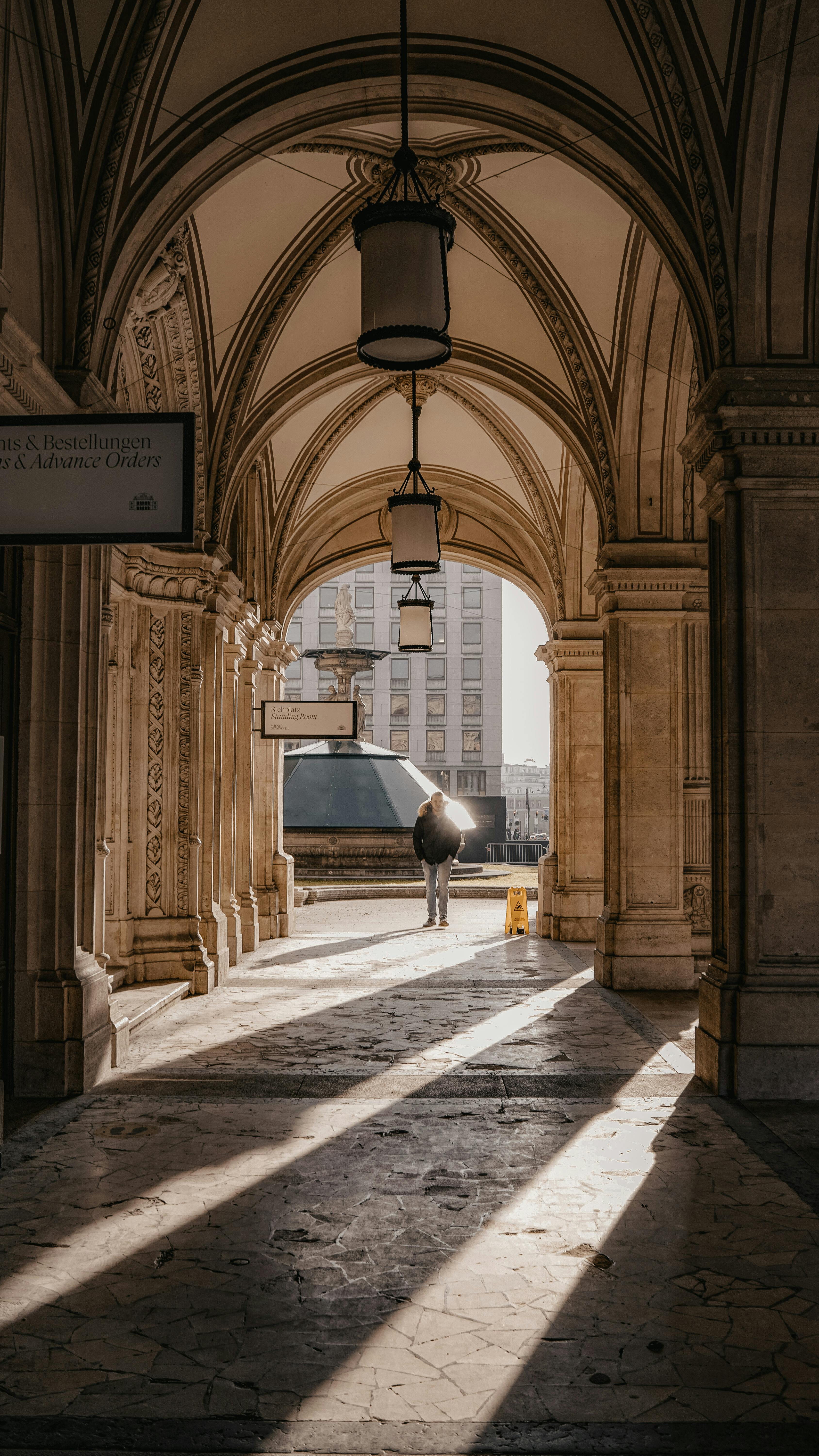 Man Standing On Arc Doorway · Free Stock Photo