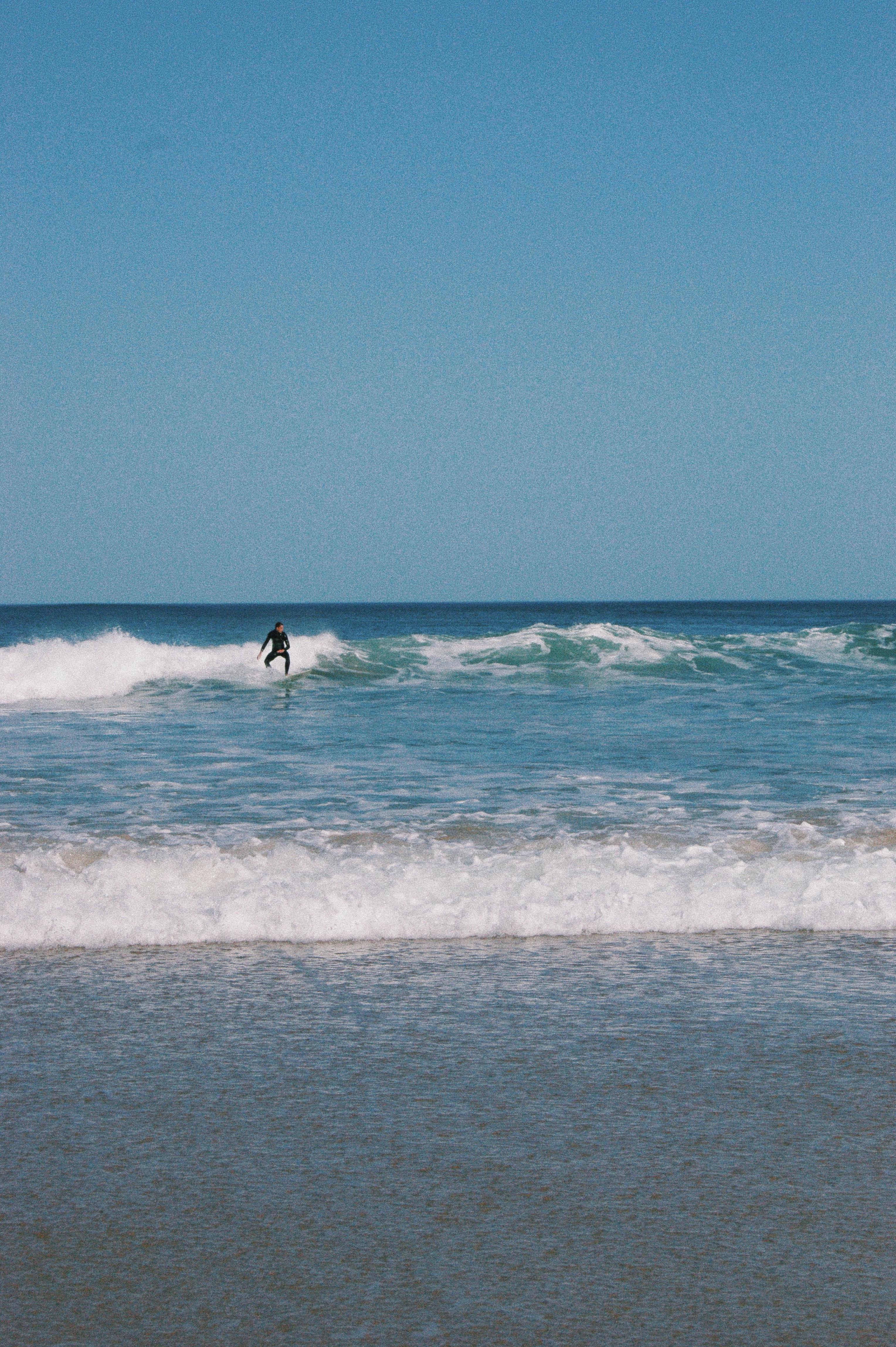 Person Surfing on Sea Waves · Free Stock Photo