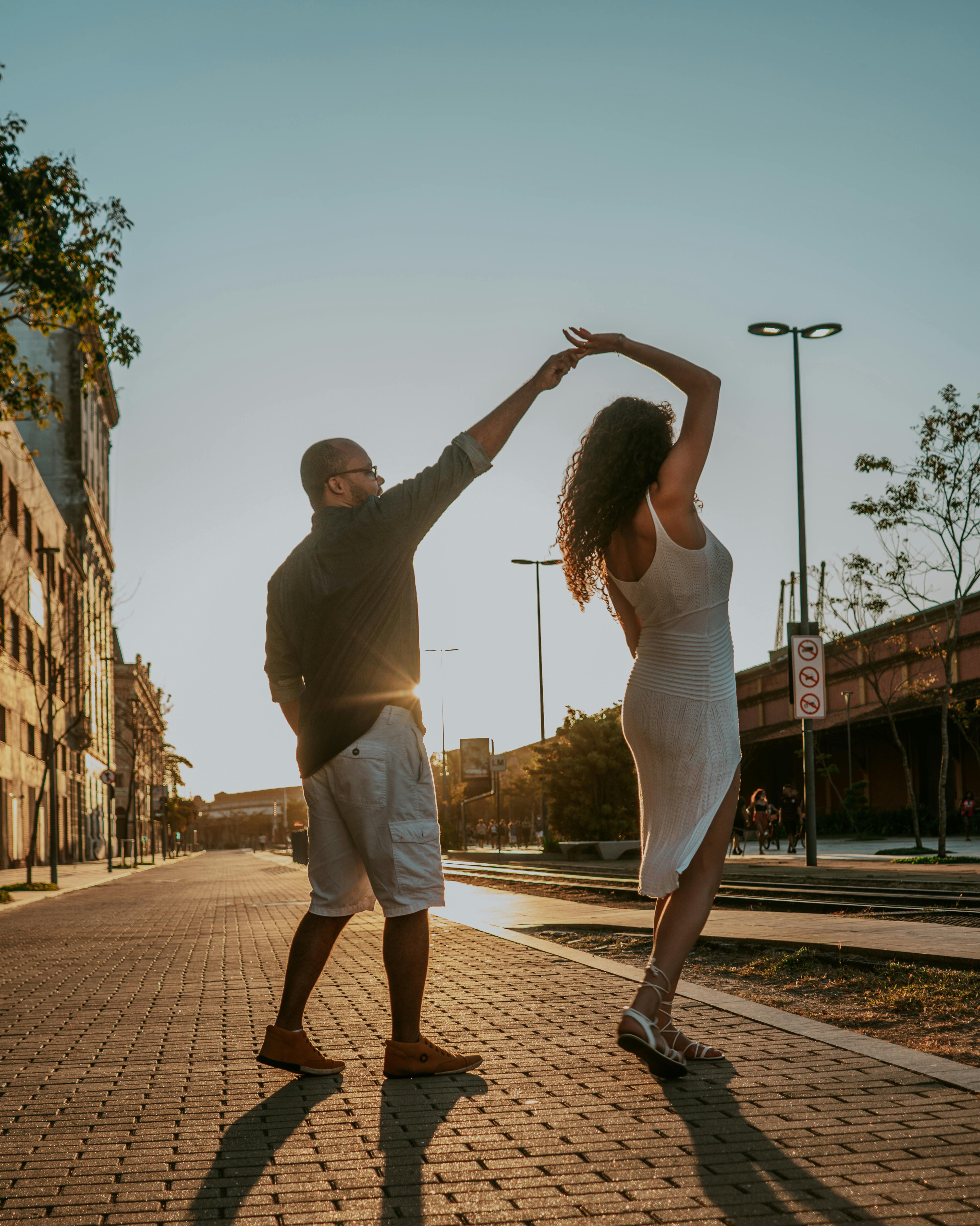 Couple Holding Hands Walking on Pathway · Free Stock Photo