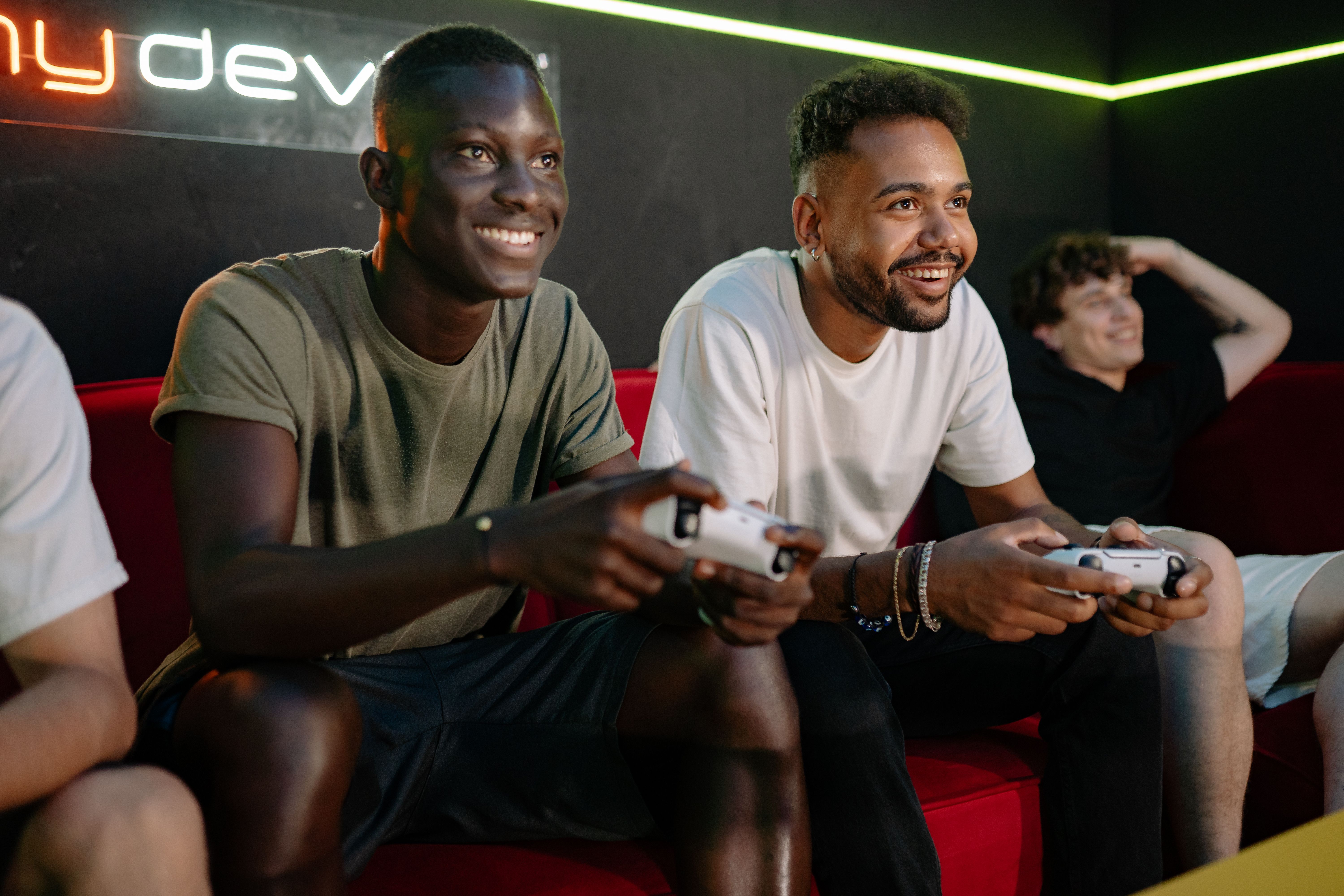 A Group of People Sitting at a Gaming Table · Free Stock Photo