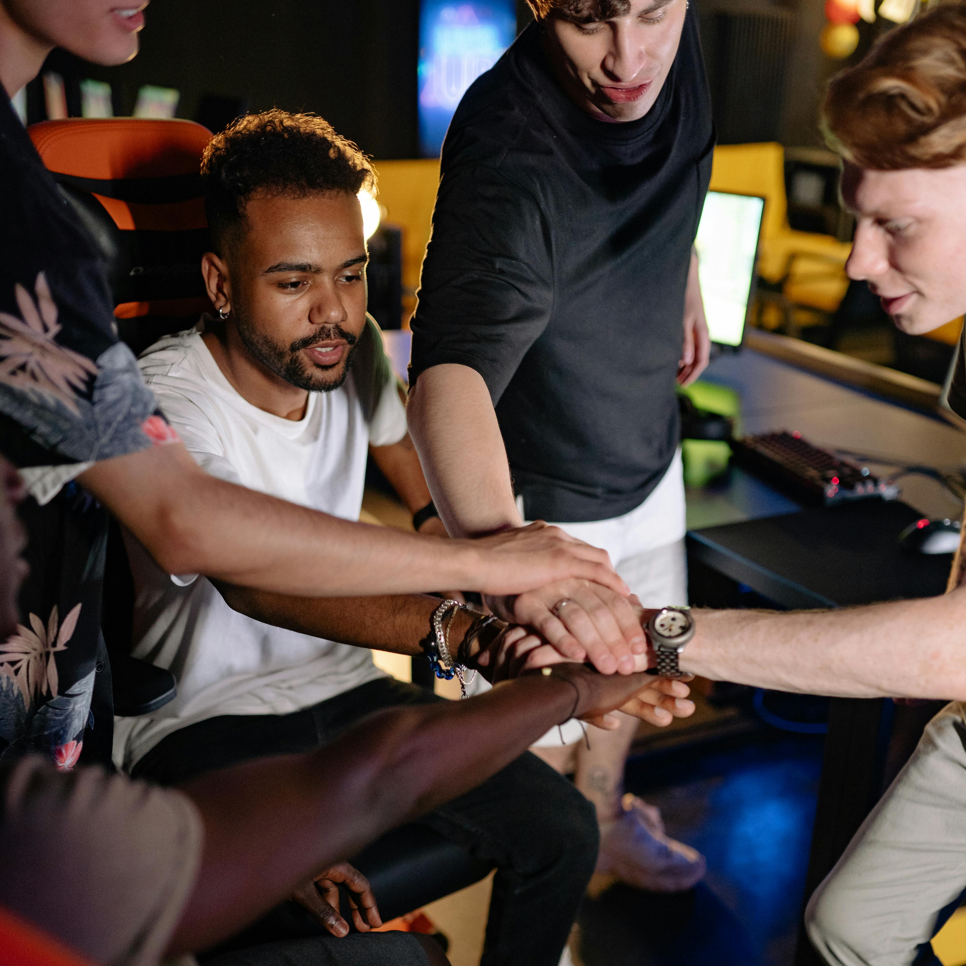 A Team with Their Hands Together · Free Stock Photo