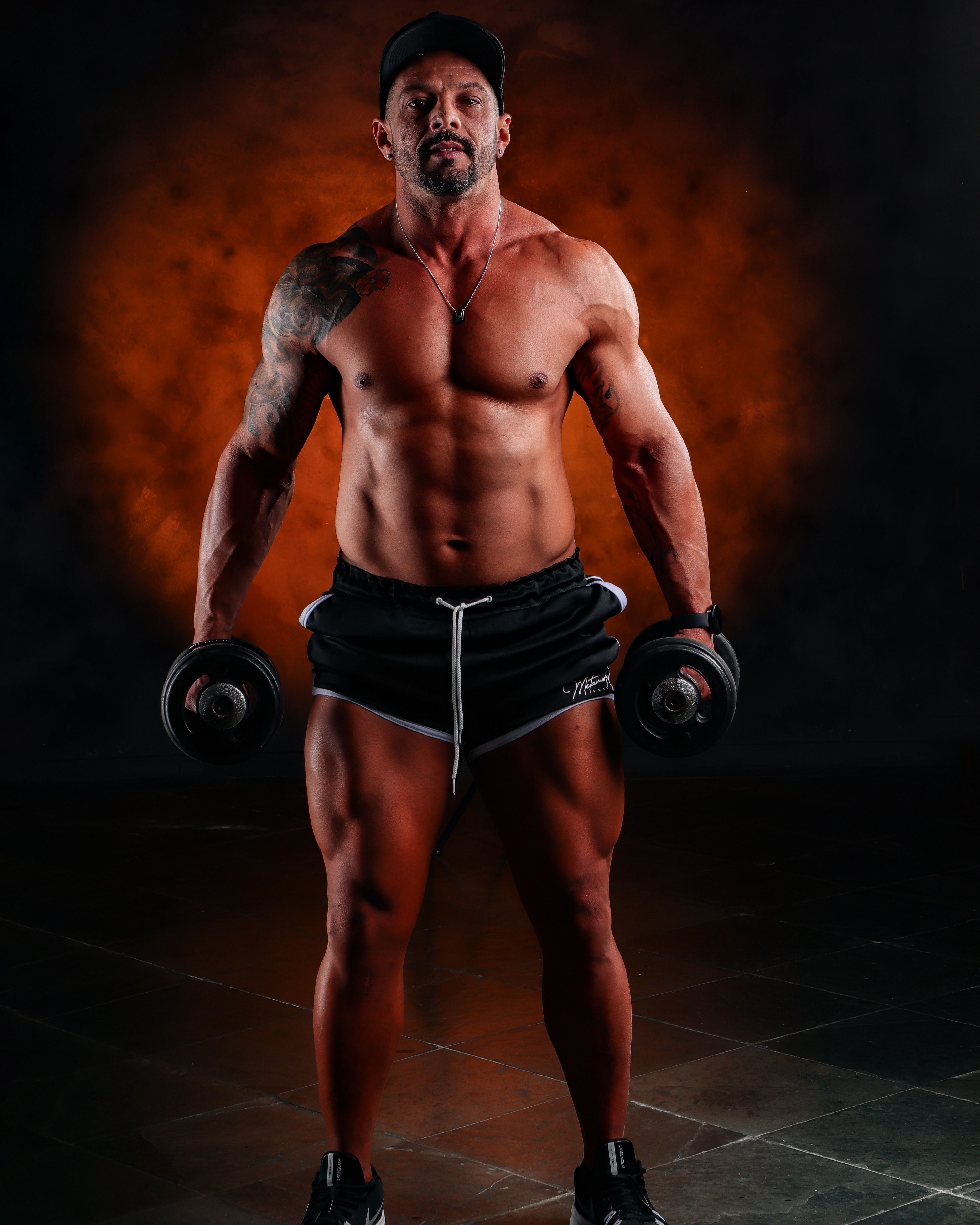 A Bodybuilder Holding Dumbbells · Free Stock Photo
