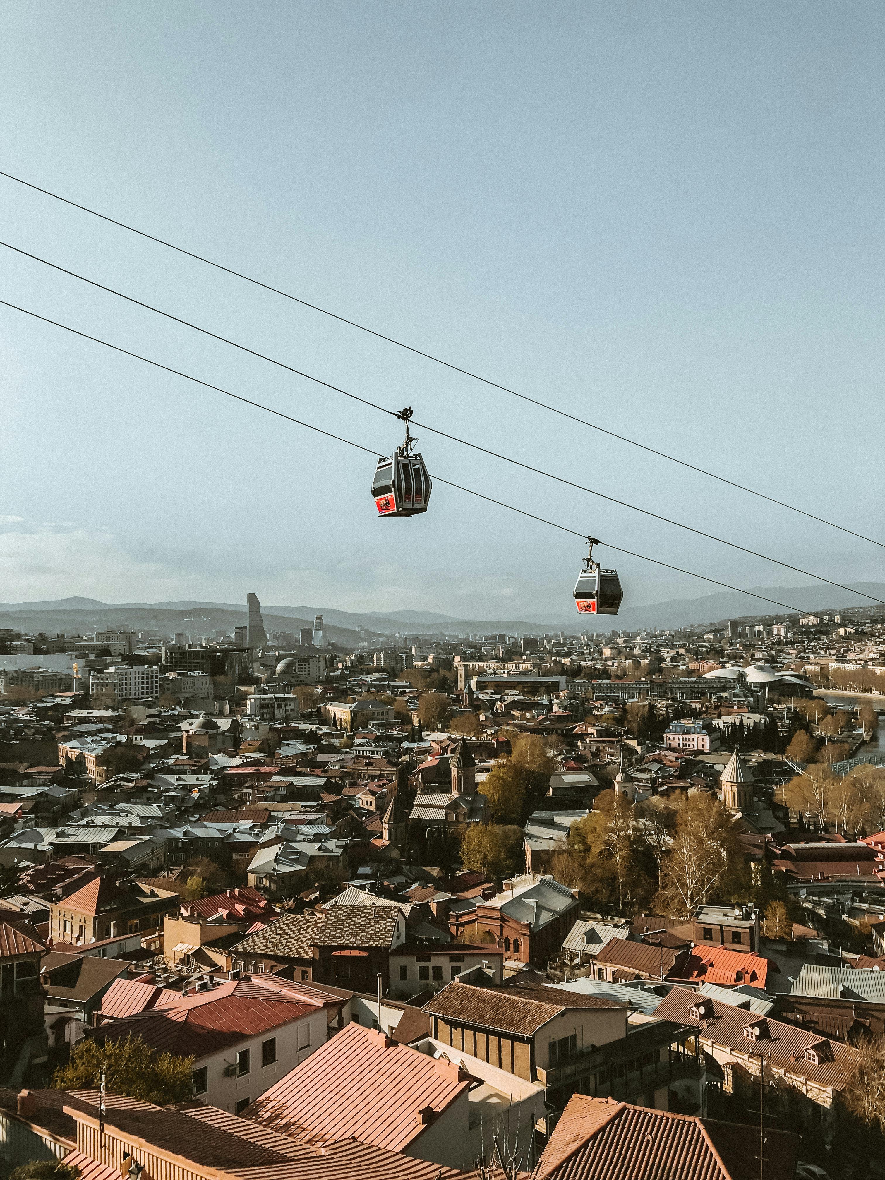 Cable Cars Over the City Buildings · Free Stock Photo