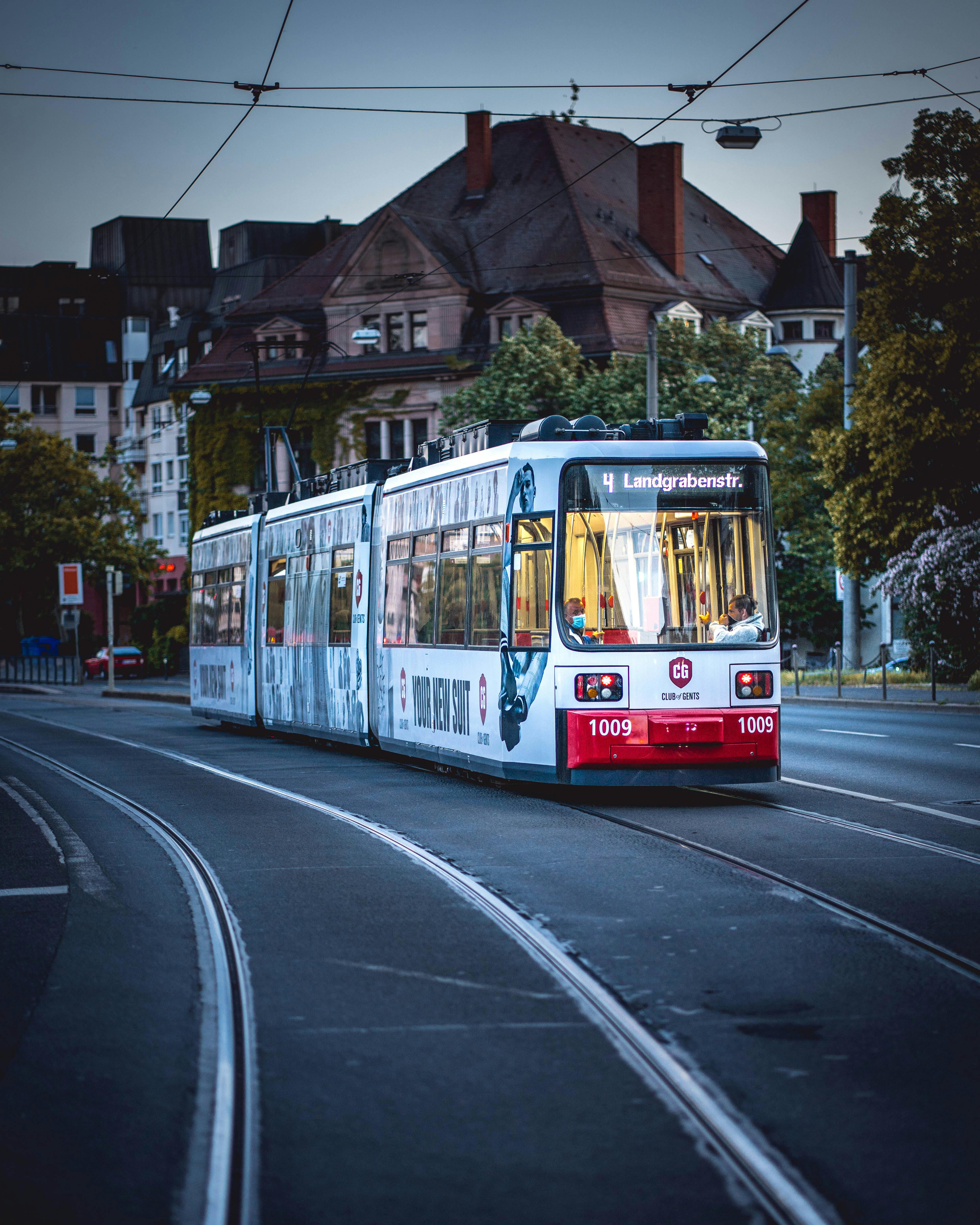 White Tram on Railway Beside a Road · Free Stock Photo