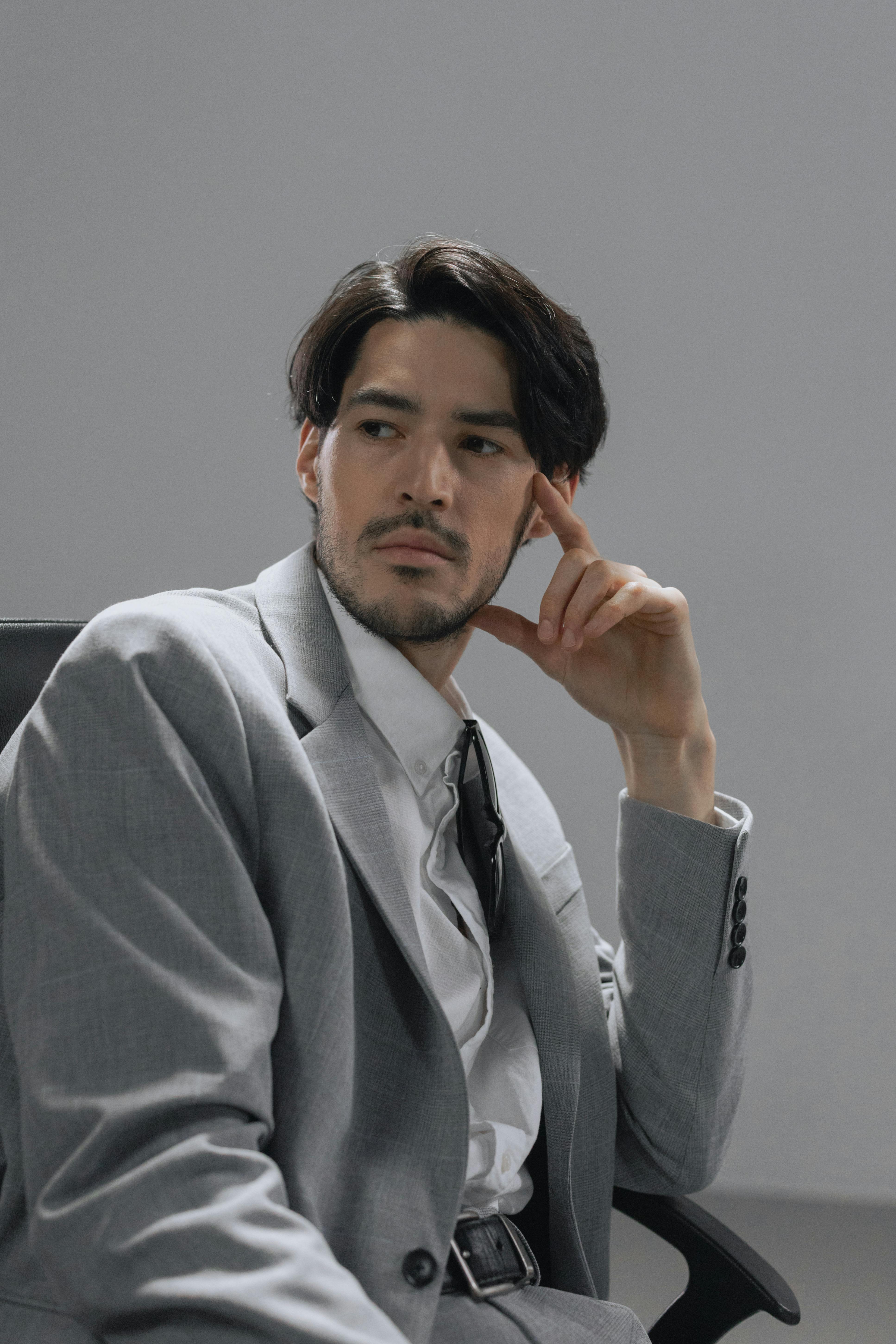 Handsome Man in Gray Suit Looking Afar · Free Stock Photo