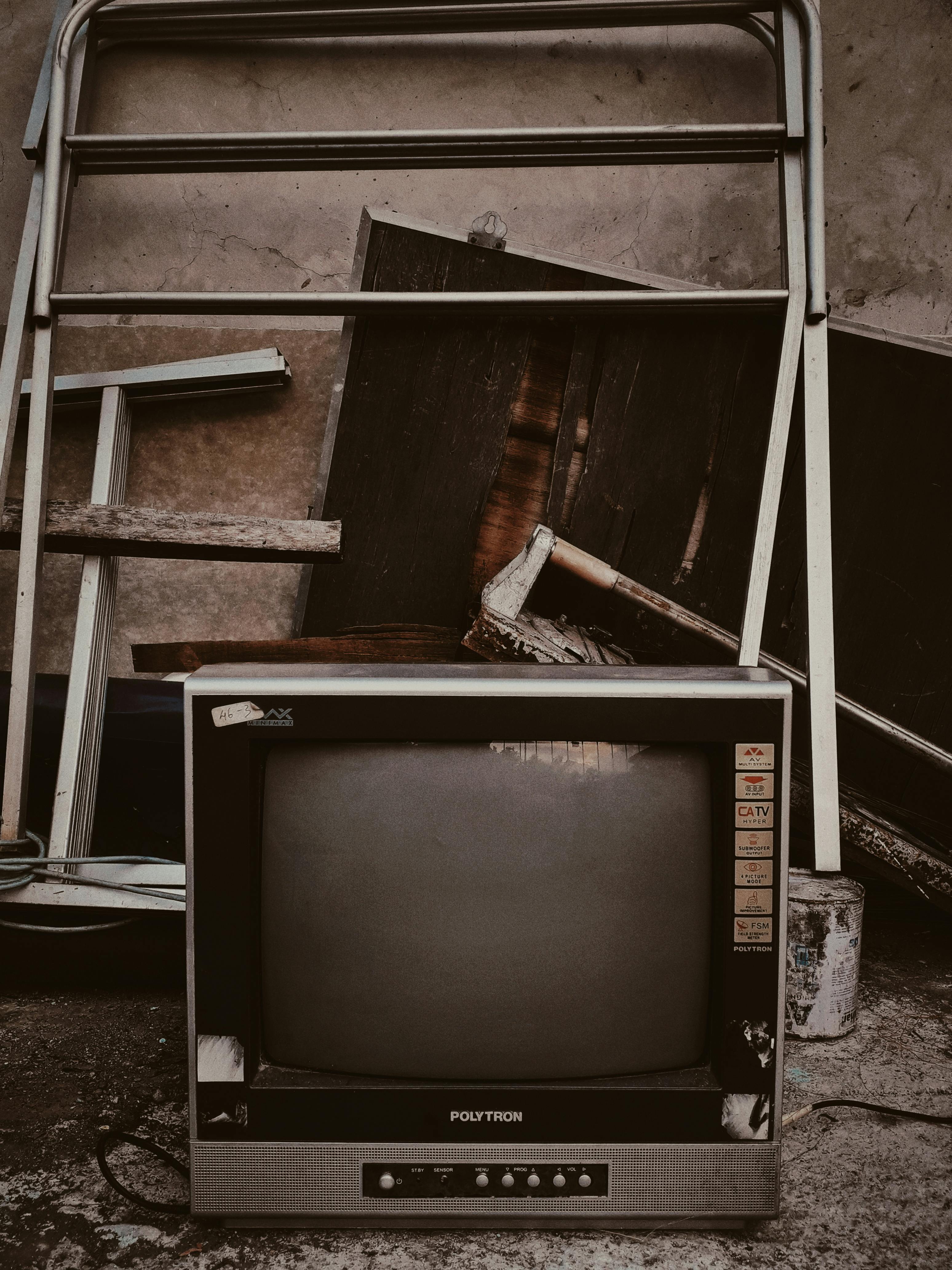 Handsome Guy Holding A Yellow Tv · Free Stock Photo