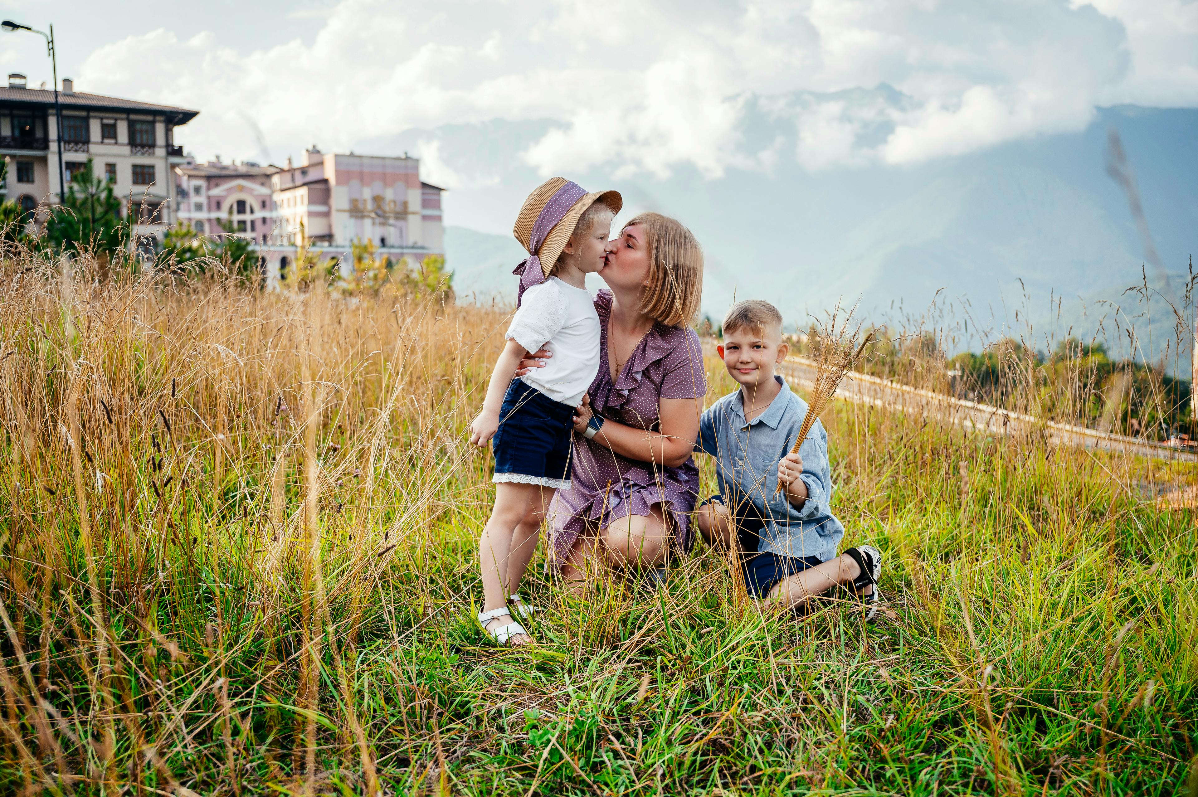 Pregnant Woman Carrying her Daughter · Free Stock Photo