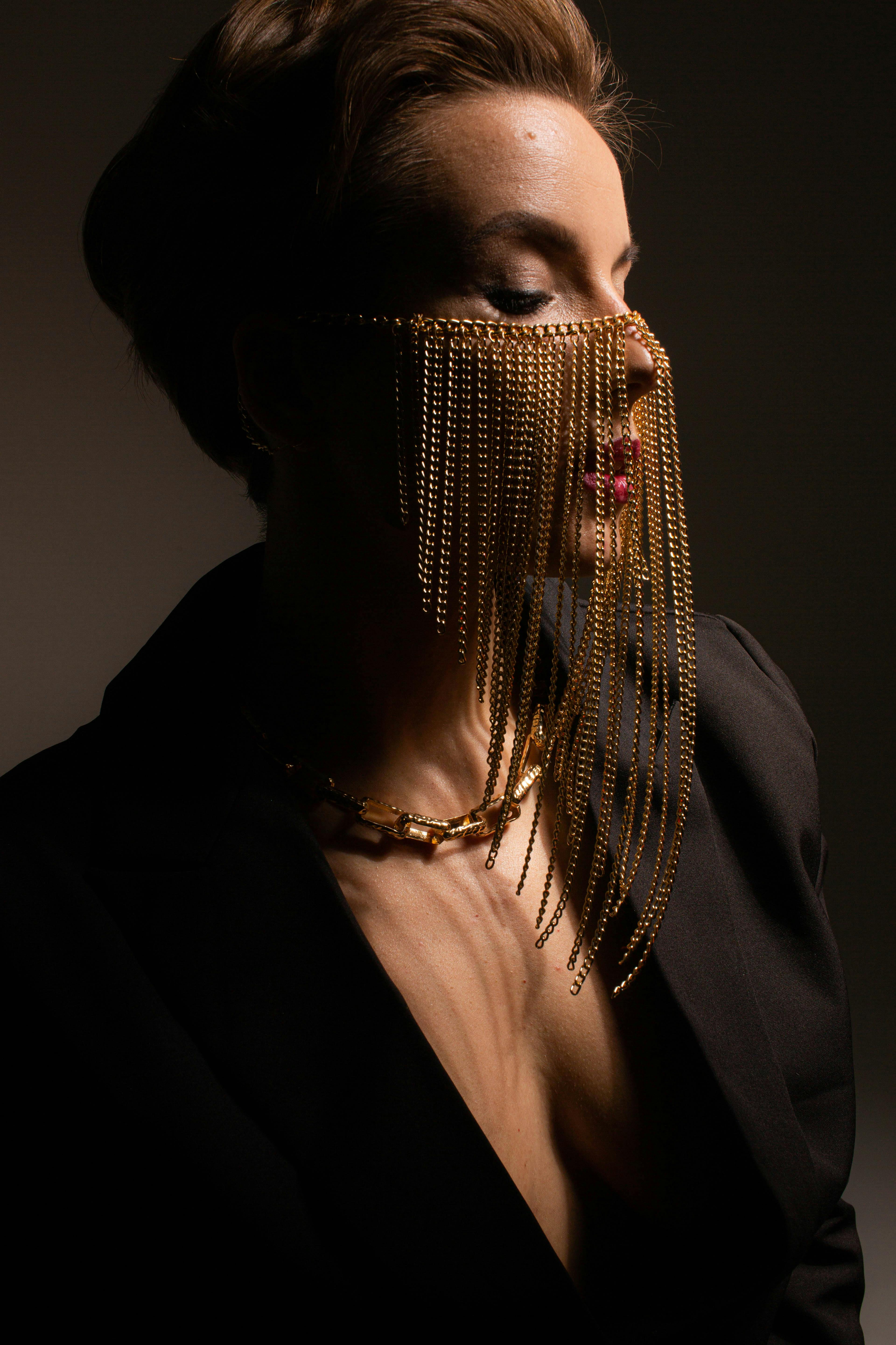 Woman on a Fashion Shoot Wearing a Bead Face Mask · Free Stock Photo